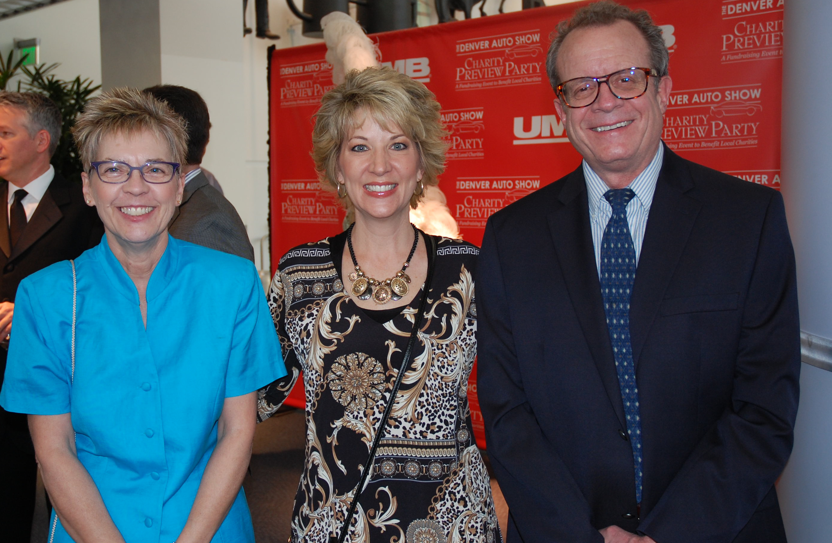 Beverly Jackson, left, with Laura Stack and Steve Raabe of the Denver Post