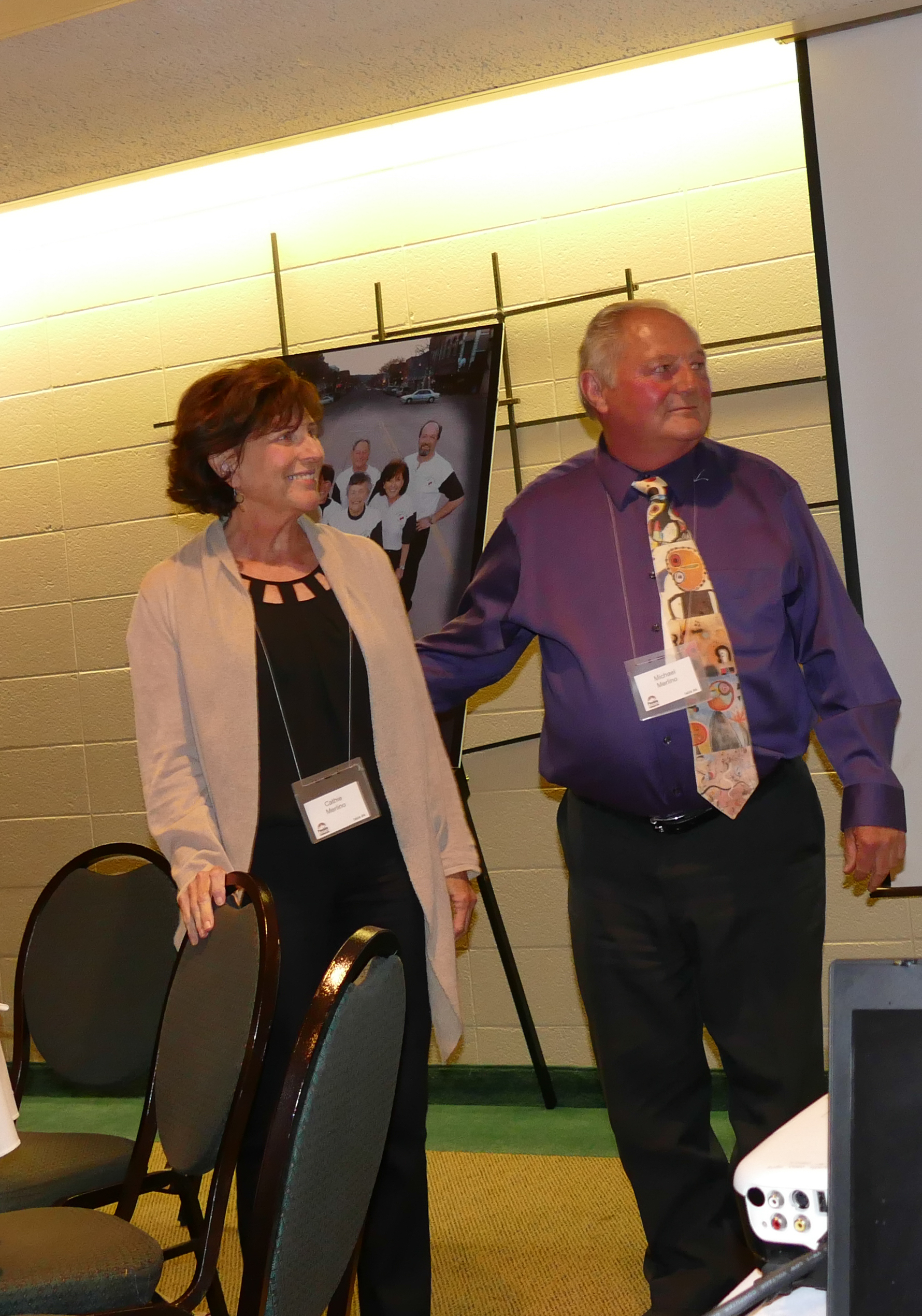 Honorees Cathie and Mike Merlino get ready to accept their induction ...