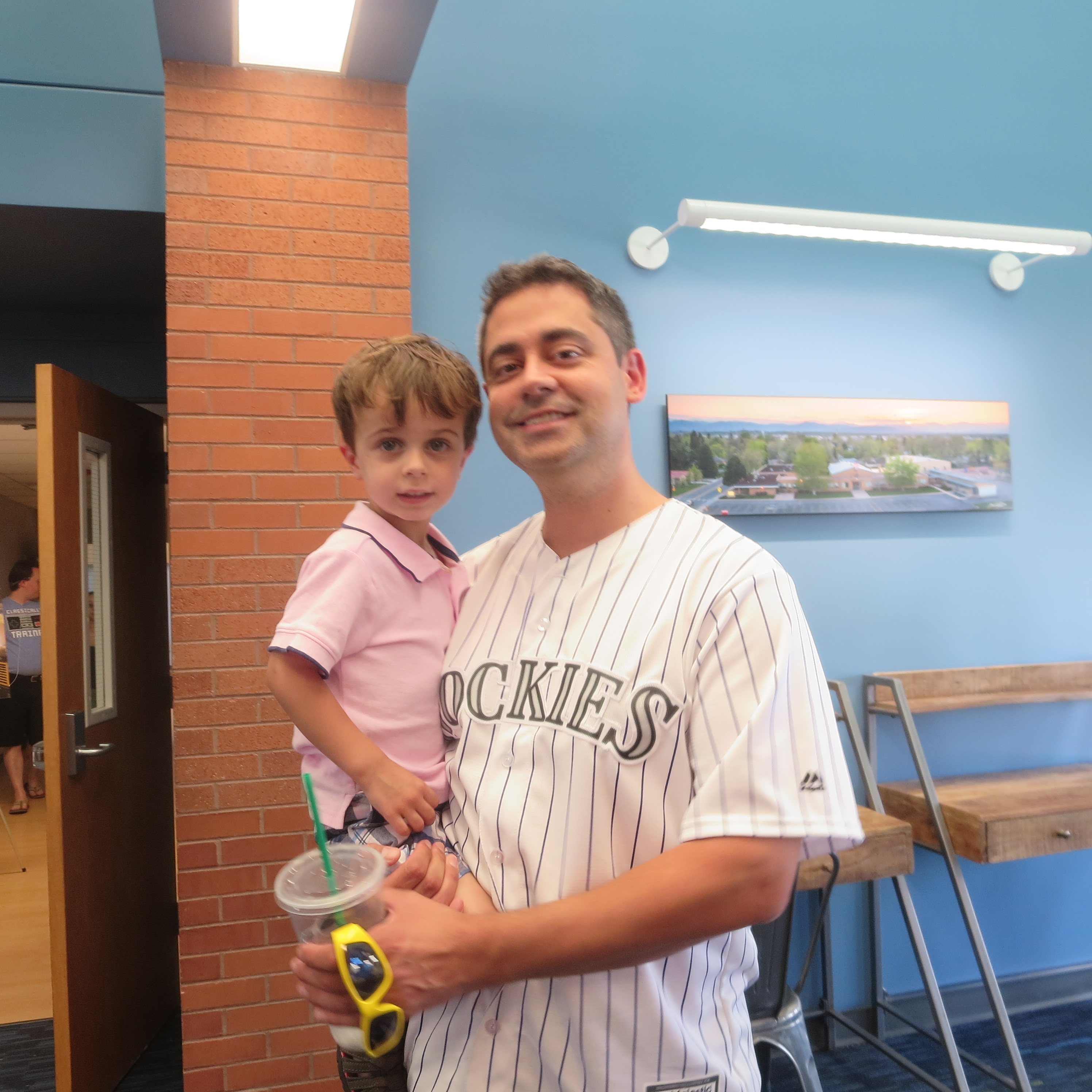Patrick Gibbs, class of 1997, with son, Elliott.