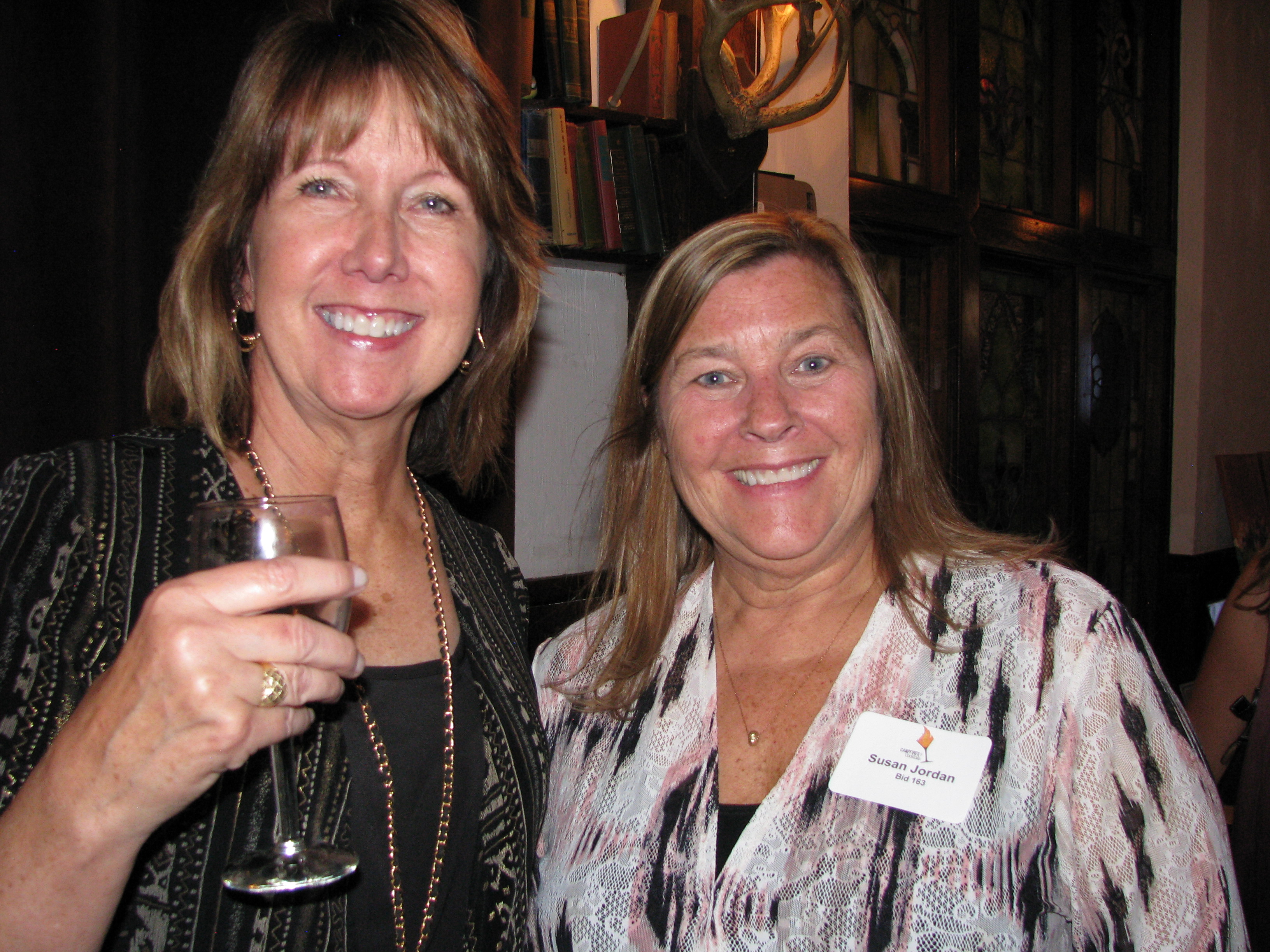 Wendy Larsen, left, and Susan Jordan toast the evening