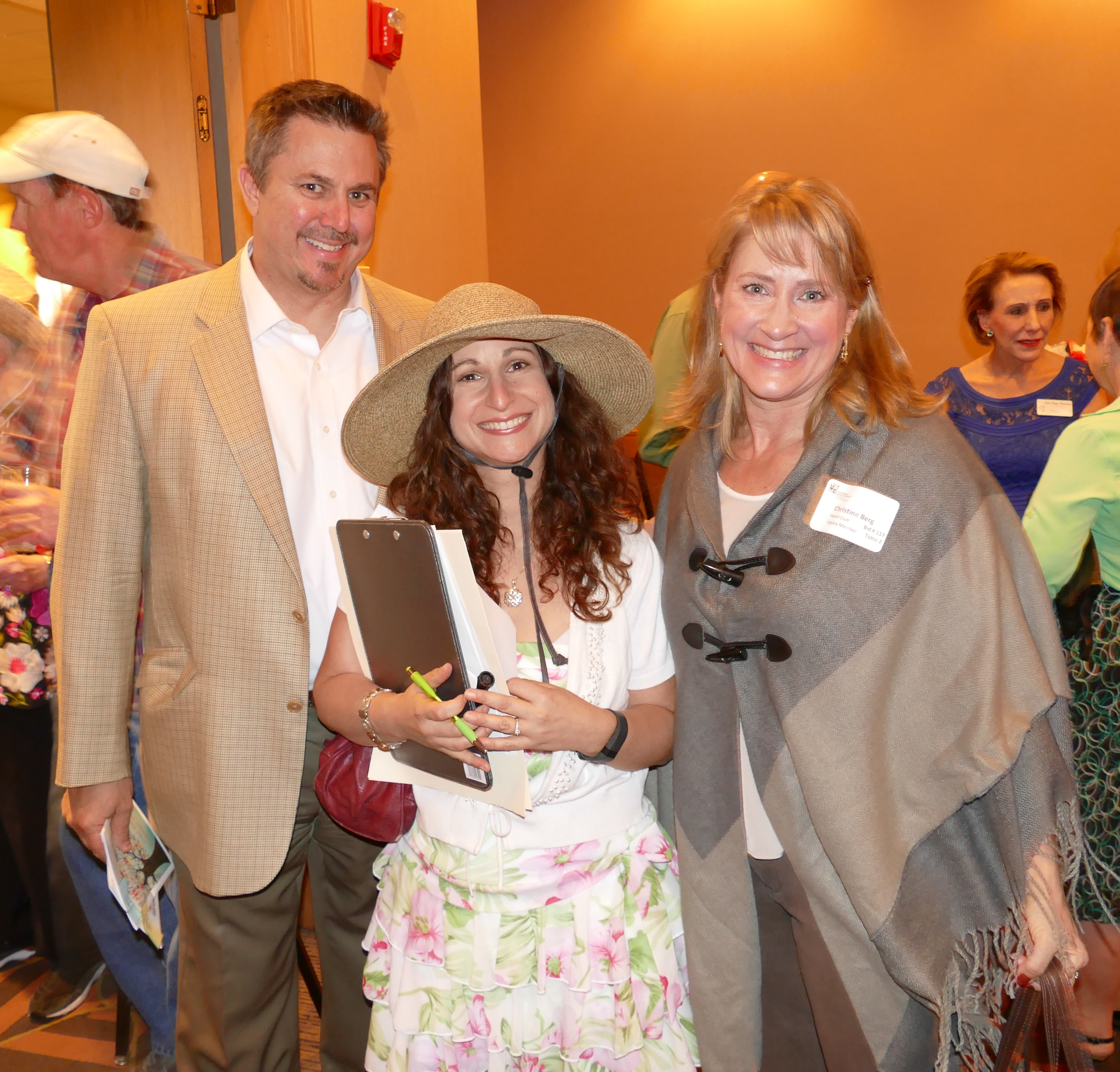 Board member Karl Berg, left, LFS's Jill Archer and Christine Berg