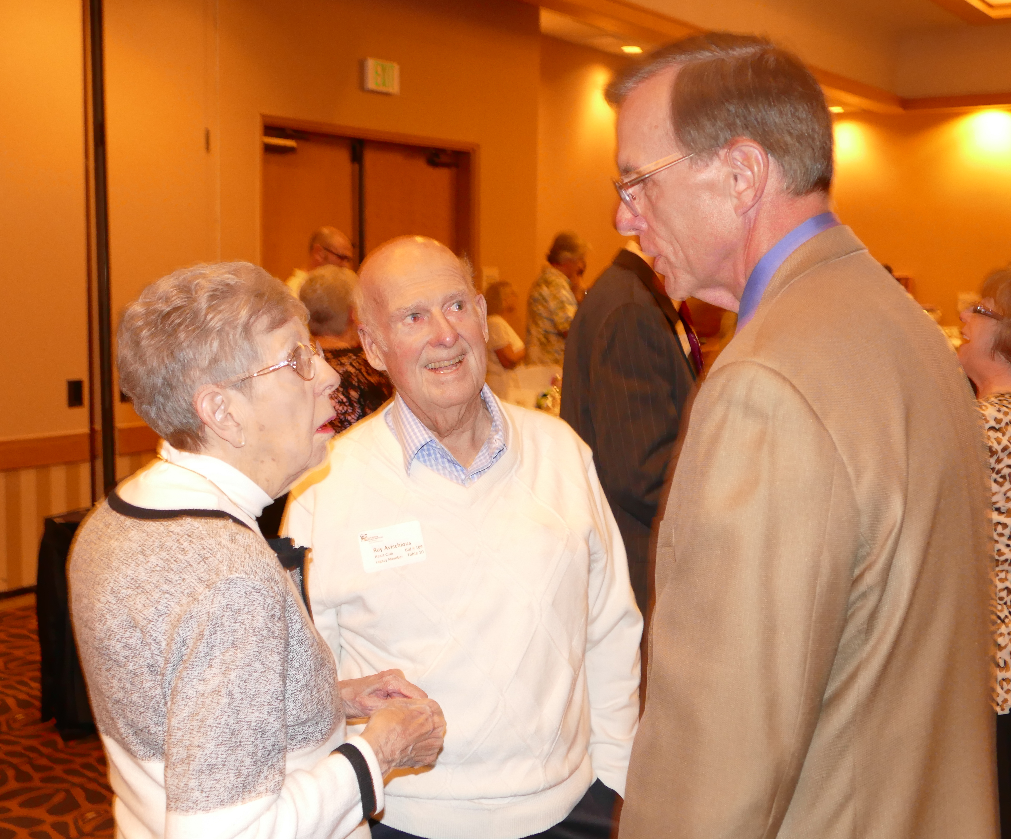 Arlene and Ray Avischious, left, talk with Jim Barclay