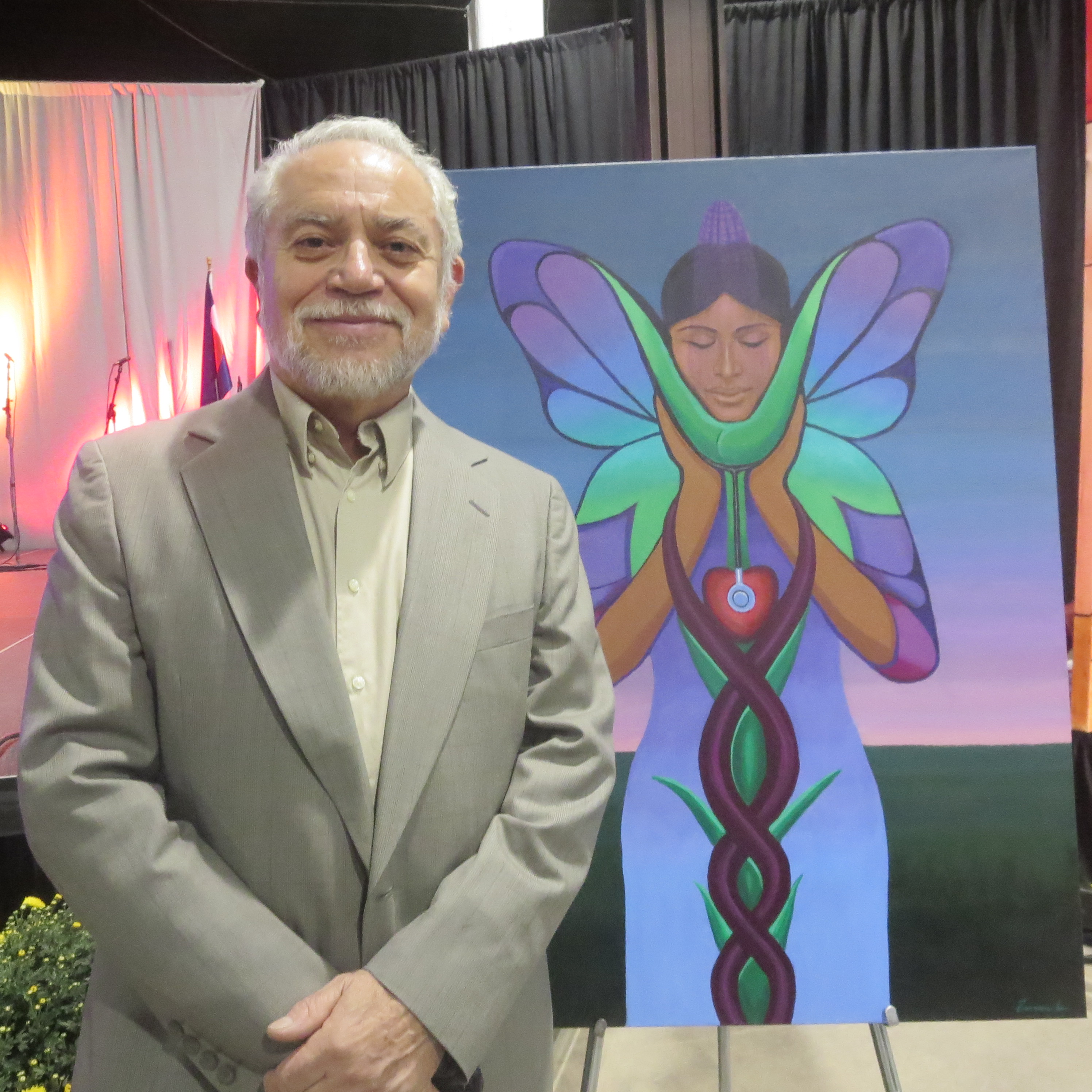 Artist, Emanuel Martinez with his painting, "Transfor Macion."