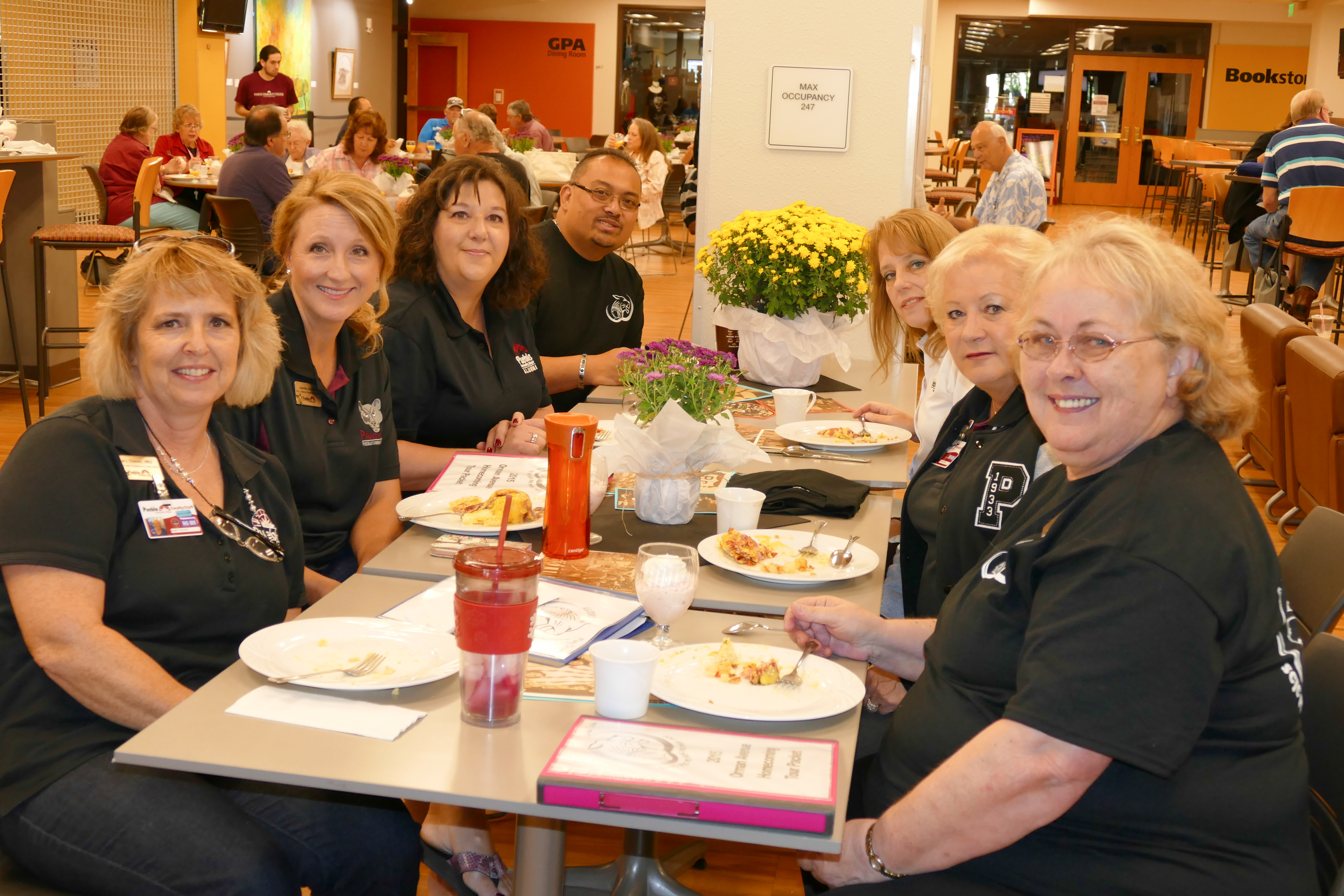 PCC staff members enjoy breakfast
