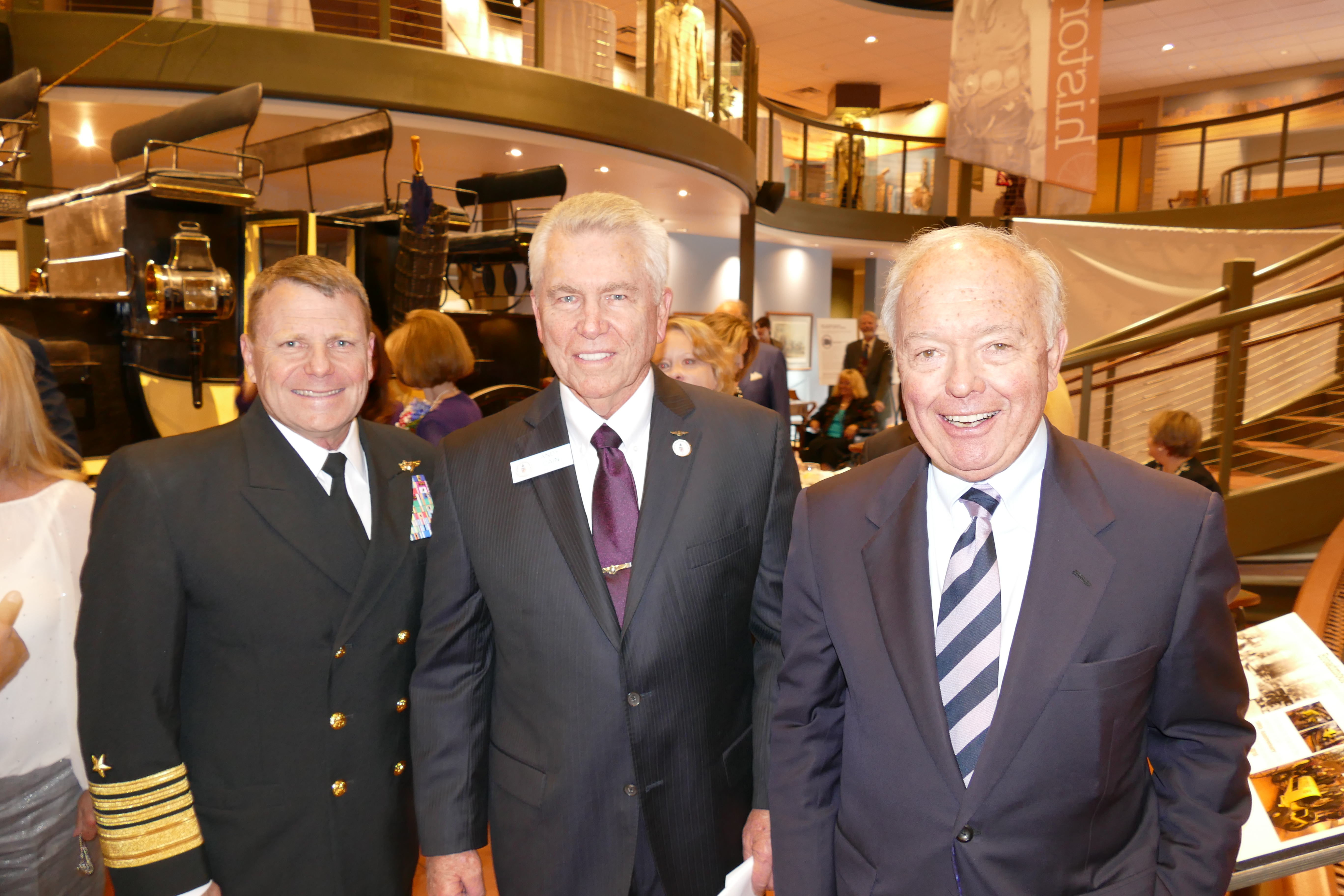 Admiral Bill Gortney, left, Board Chair Andy Cain and Bill Hybl