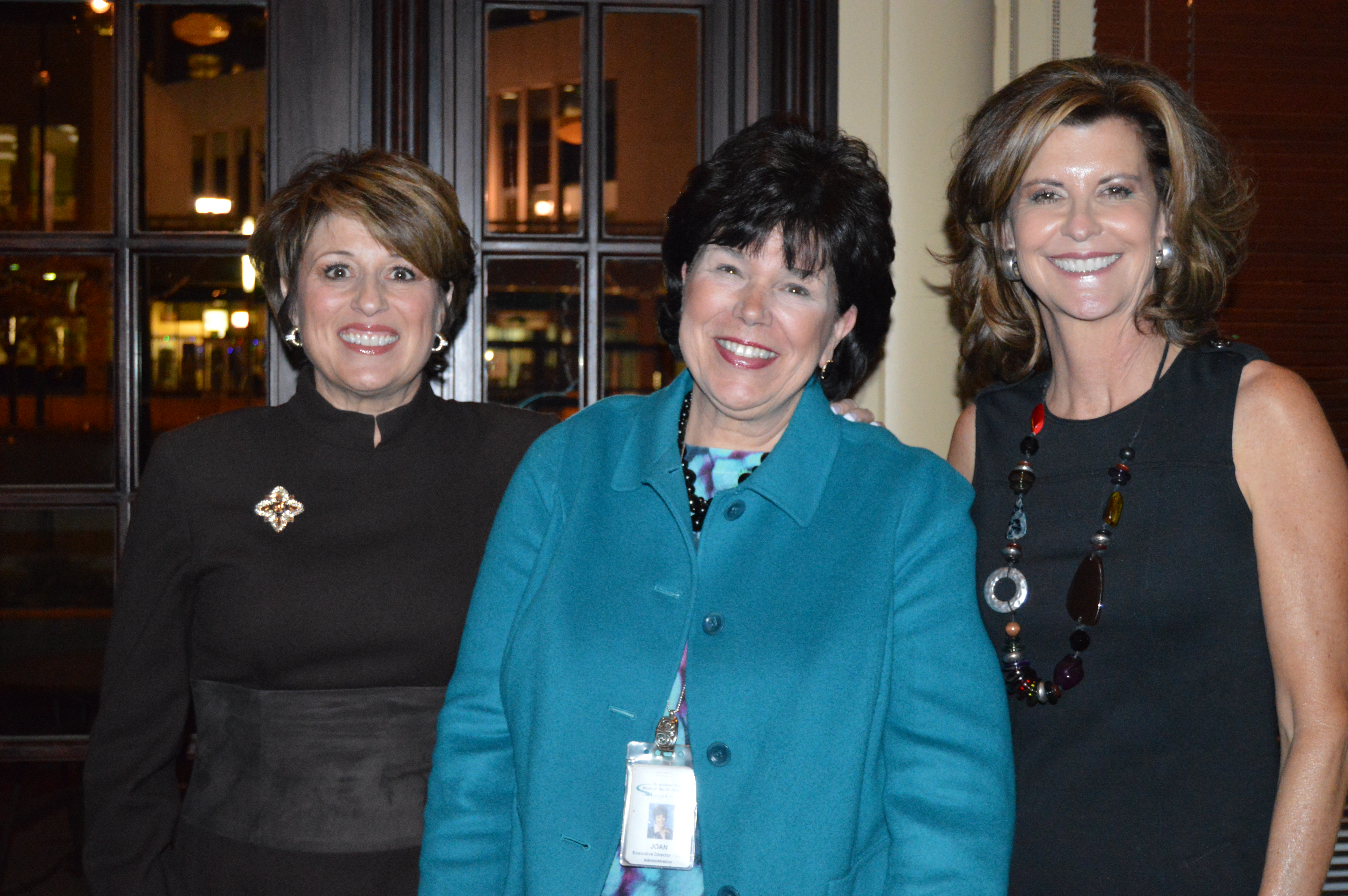 Executive Director/CEO Joan DiMaria (center), with Shine On gala co ...