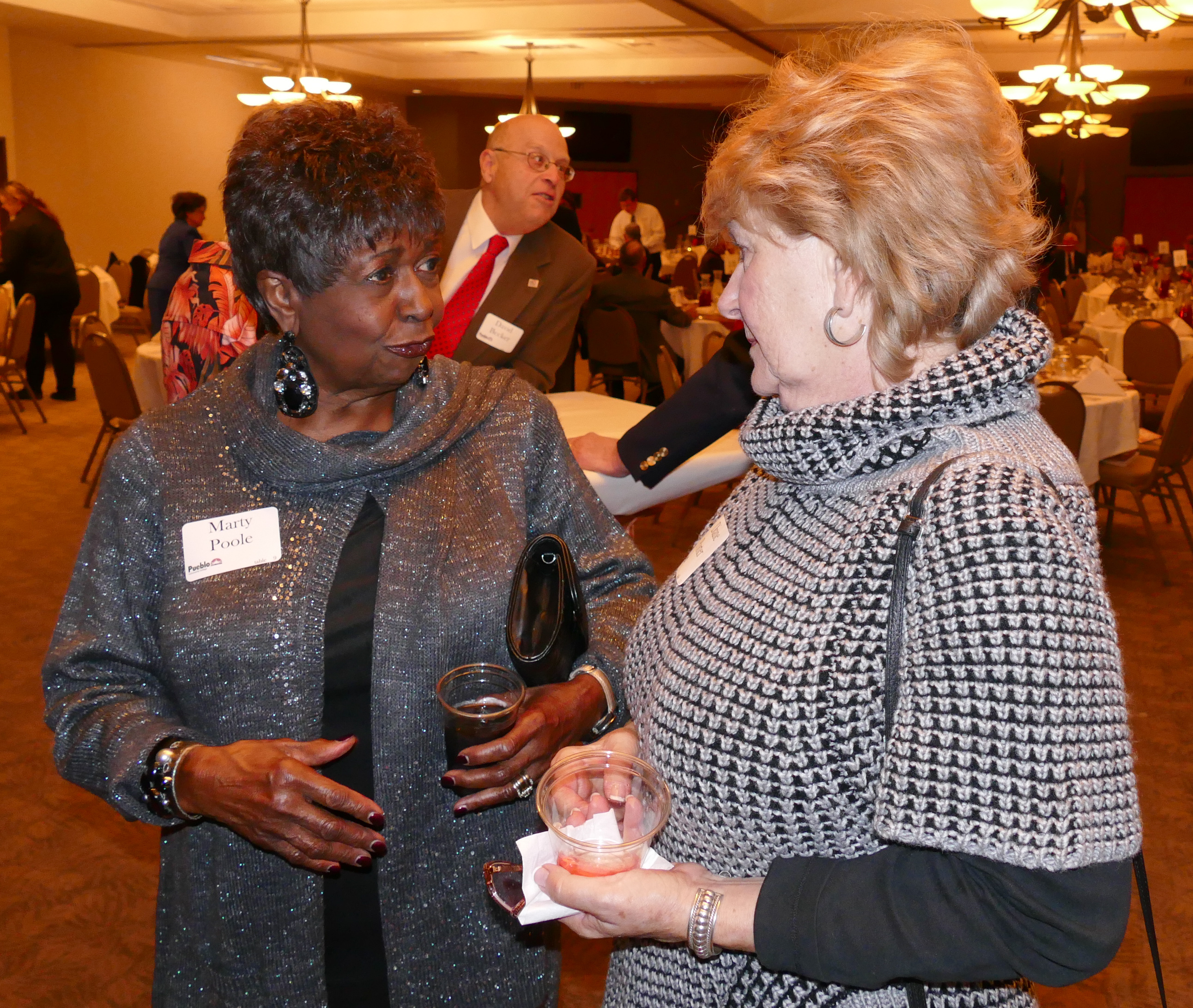 Marty Poole, left, chats with Diane Porter