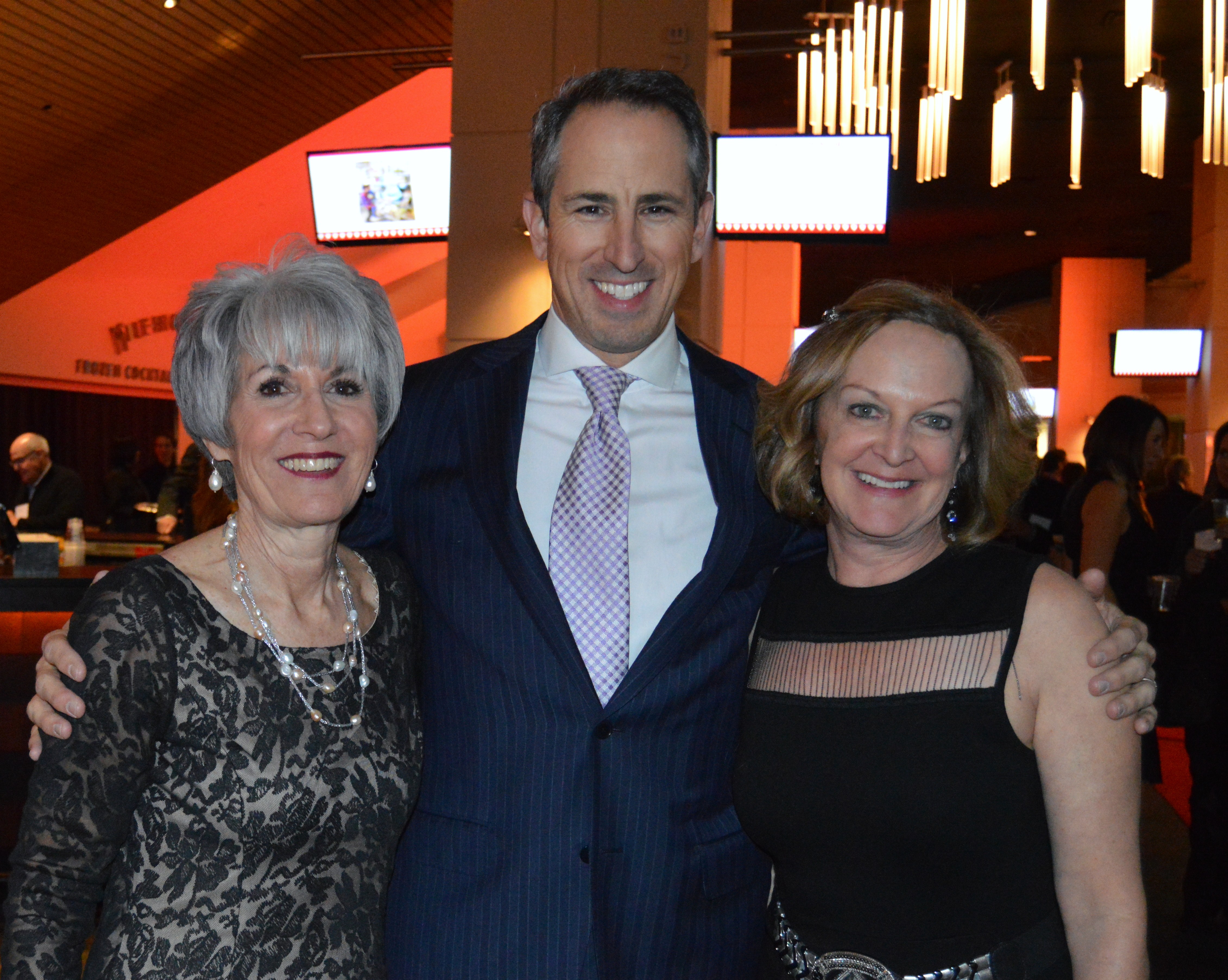 Board chair Jane E. Rosenbaum (left), with award recipients Adam Agron ...
