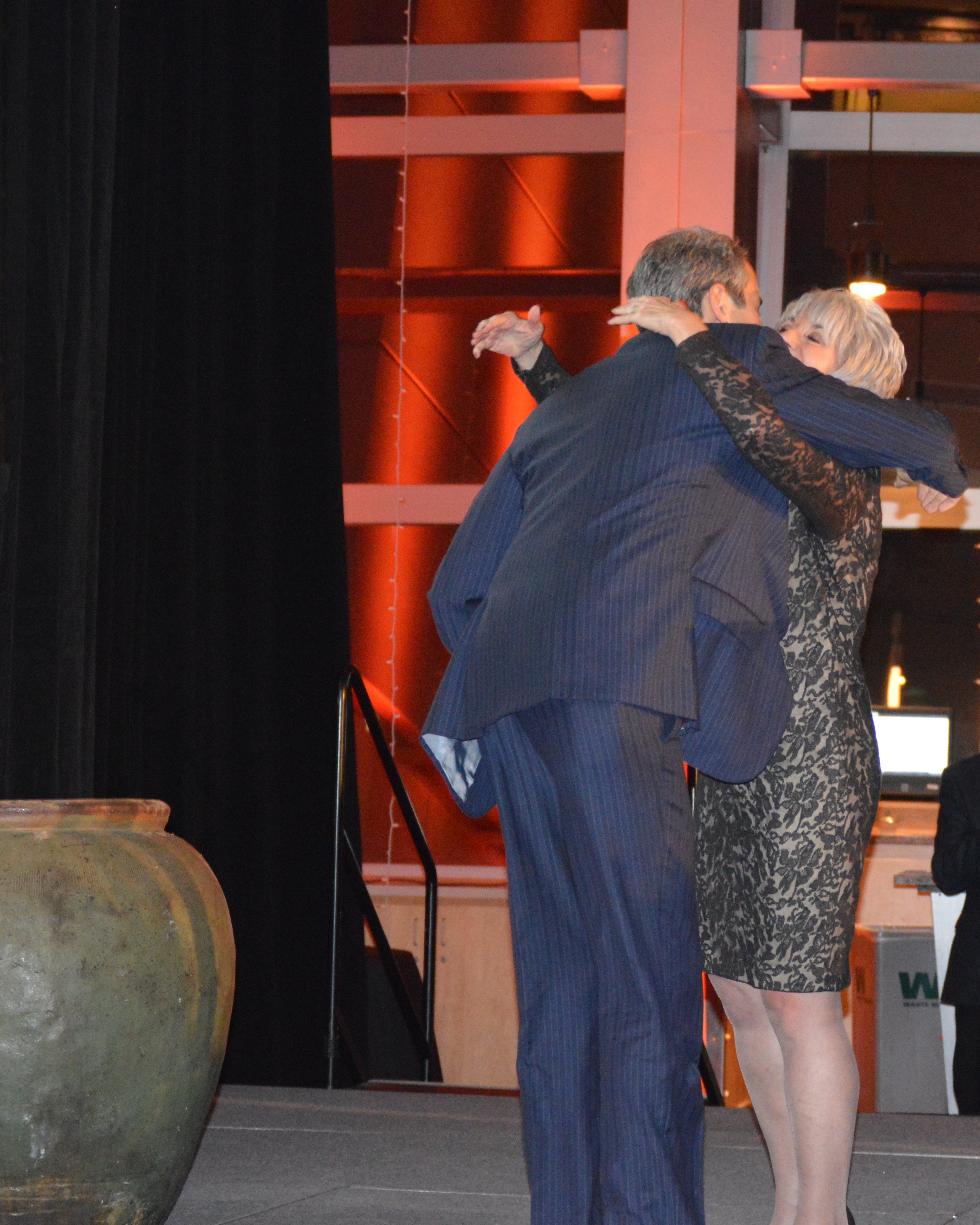 Jane E. Rosenbaum offers a congratulatory hug to award recipient Adam ...
