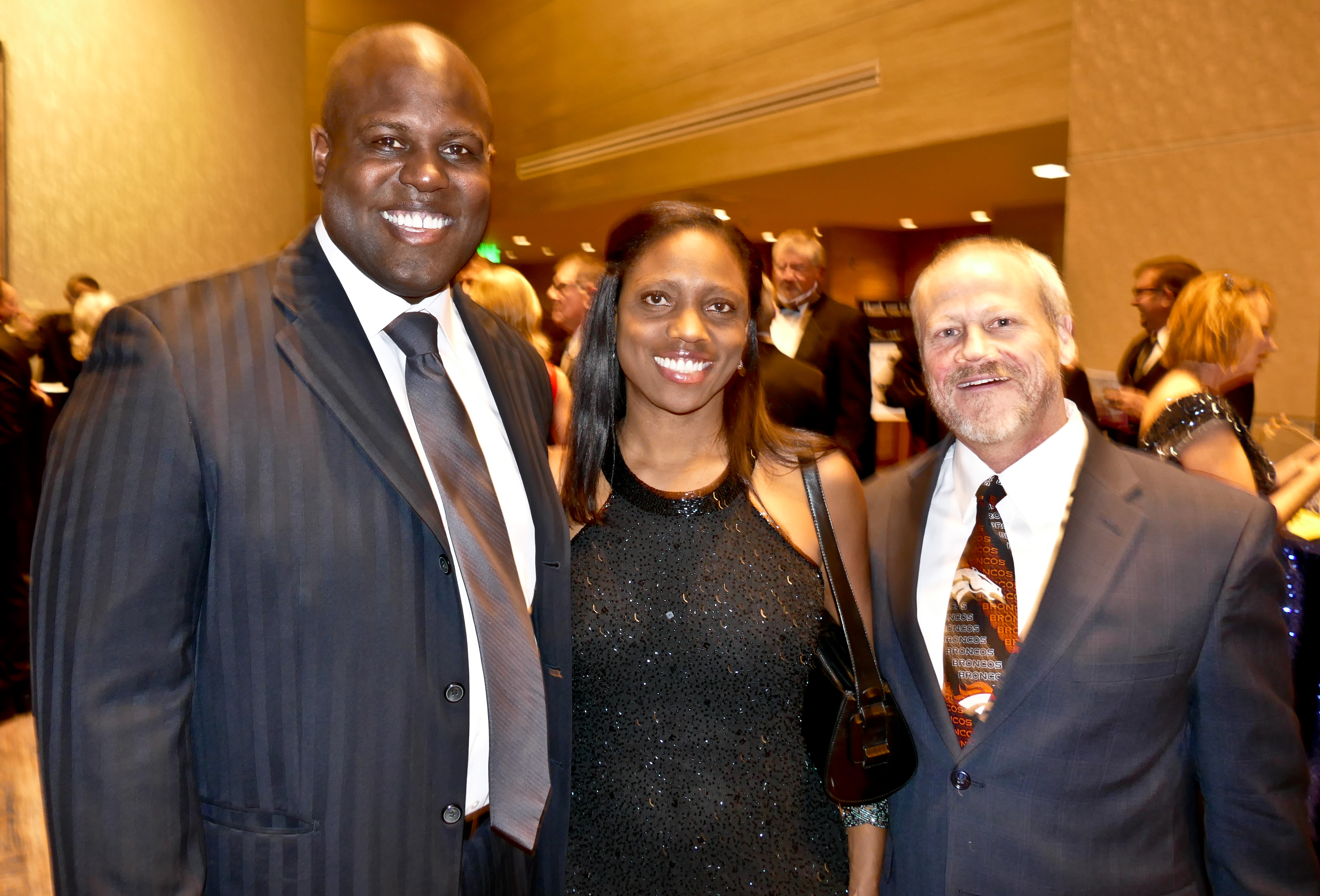 Emcee Reggie Rivers and his wife Stephanie with Randy Ohlson