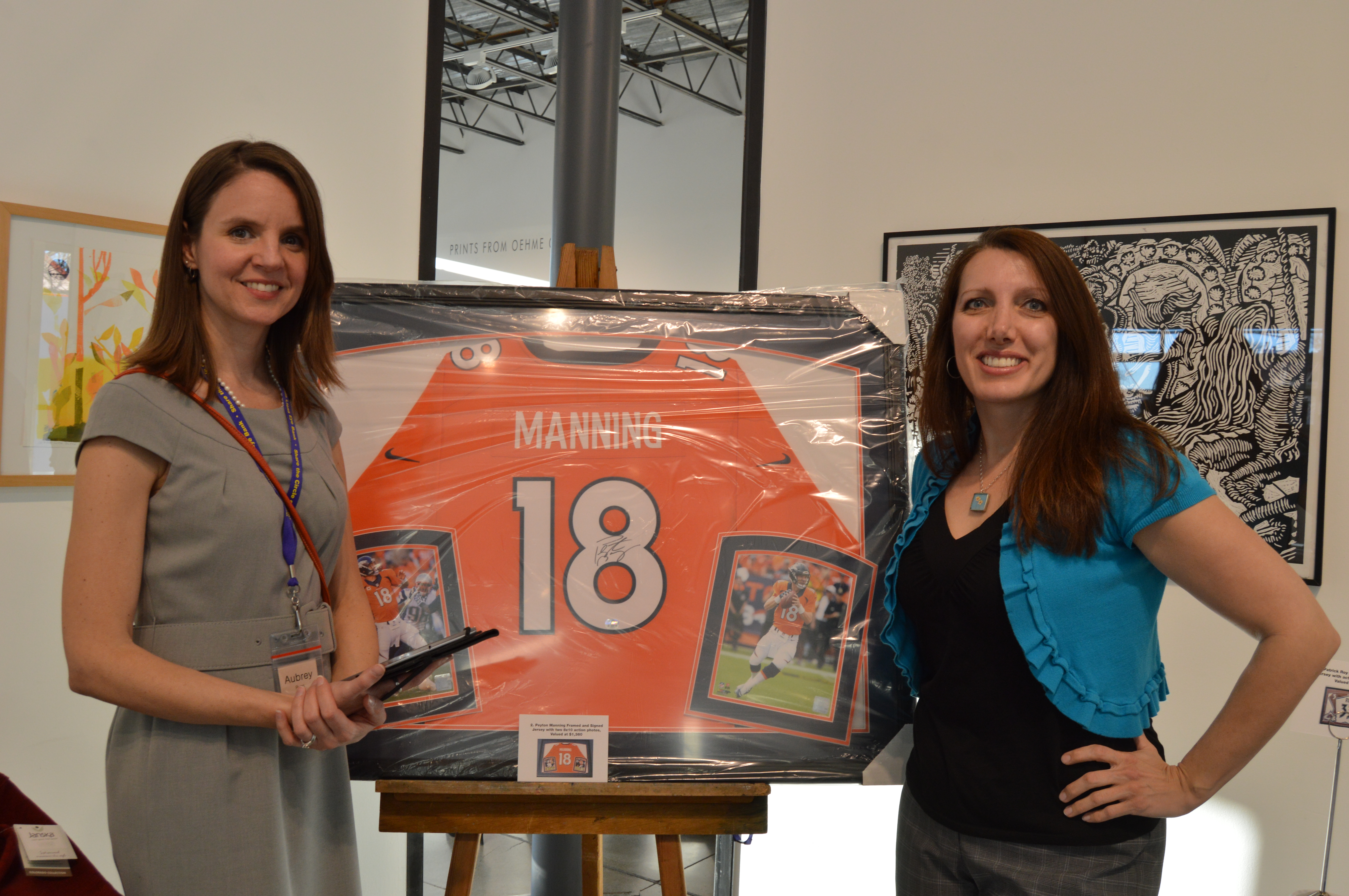 Aubrey Ryan (left) and Angie Jones check out the Peyton Manning jersey ...