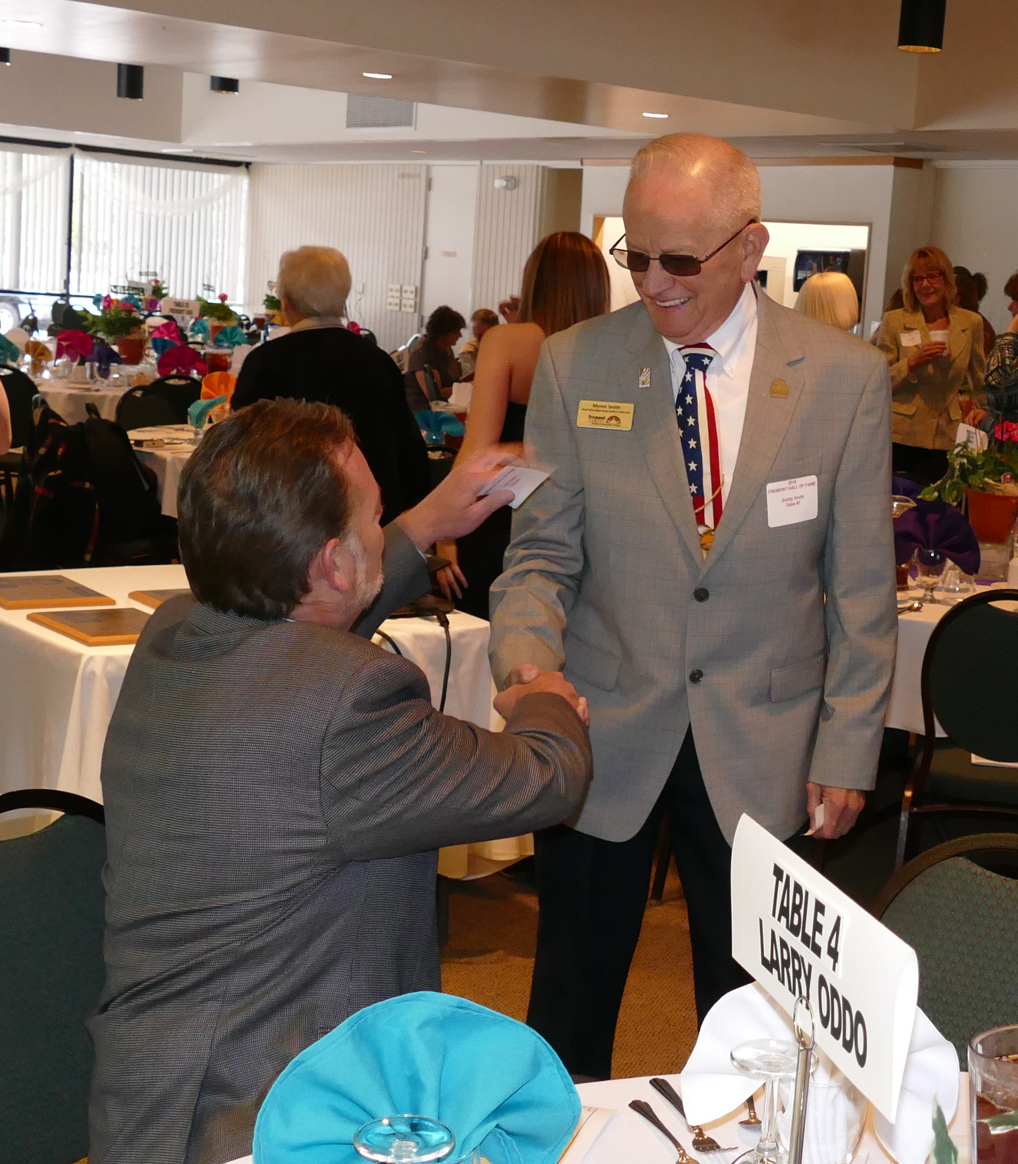 Inductees Larry Oddo, left, and "Smitty" Smith congratulate each other