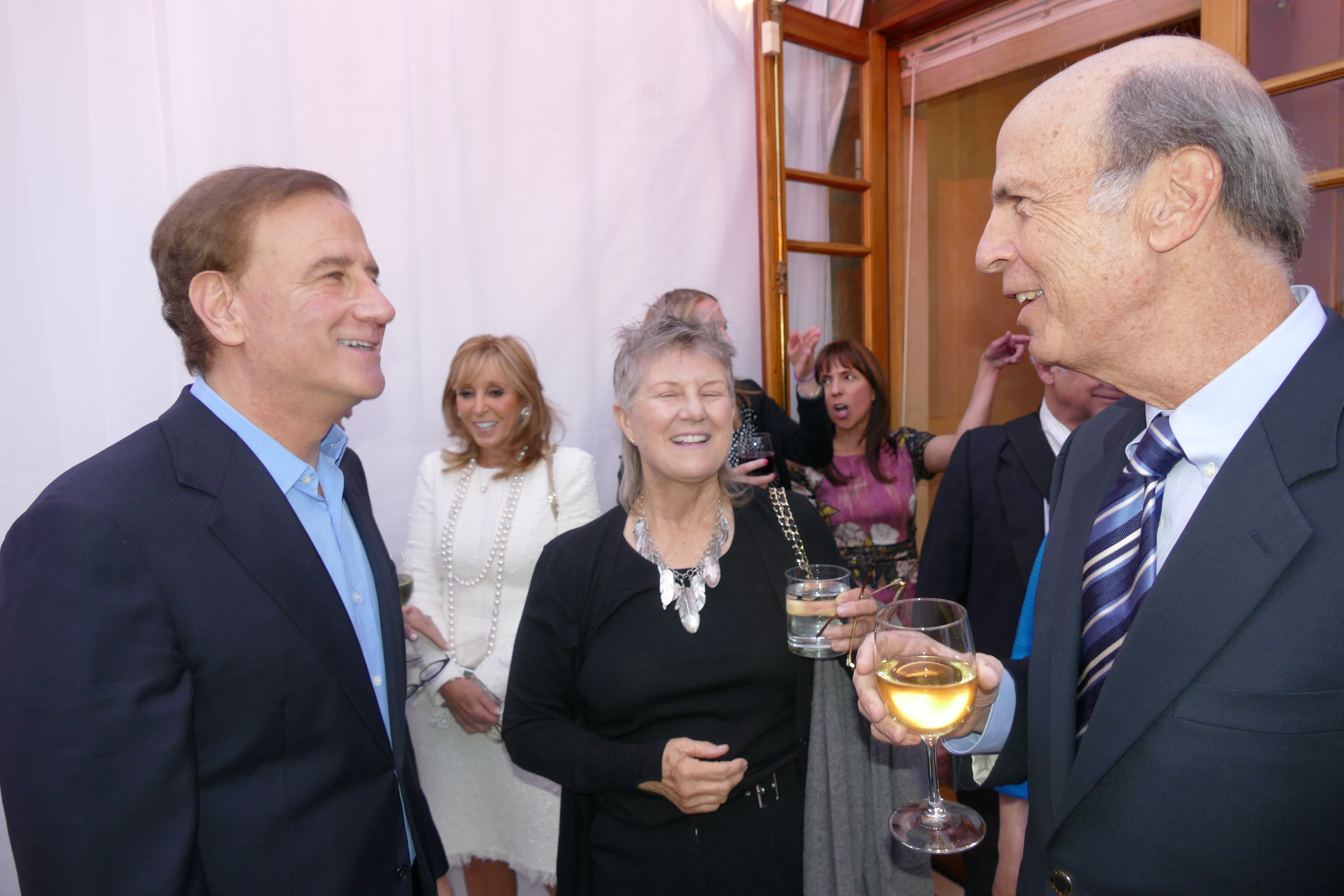 Dr Michael Salem, left, greets Bob and Jacqueline Helpern