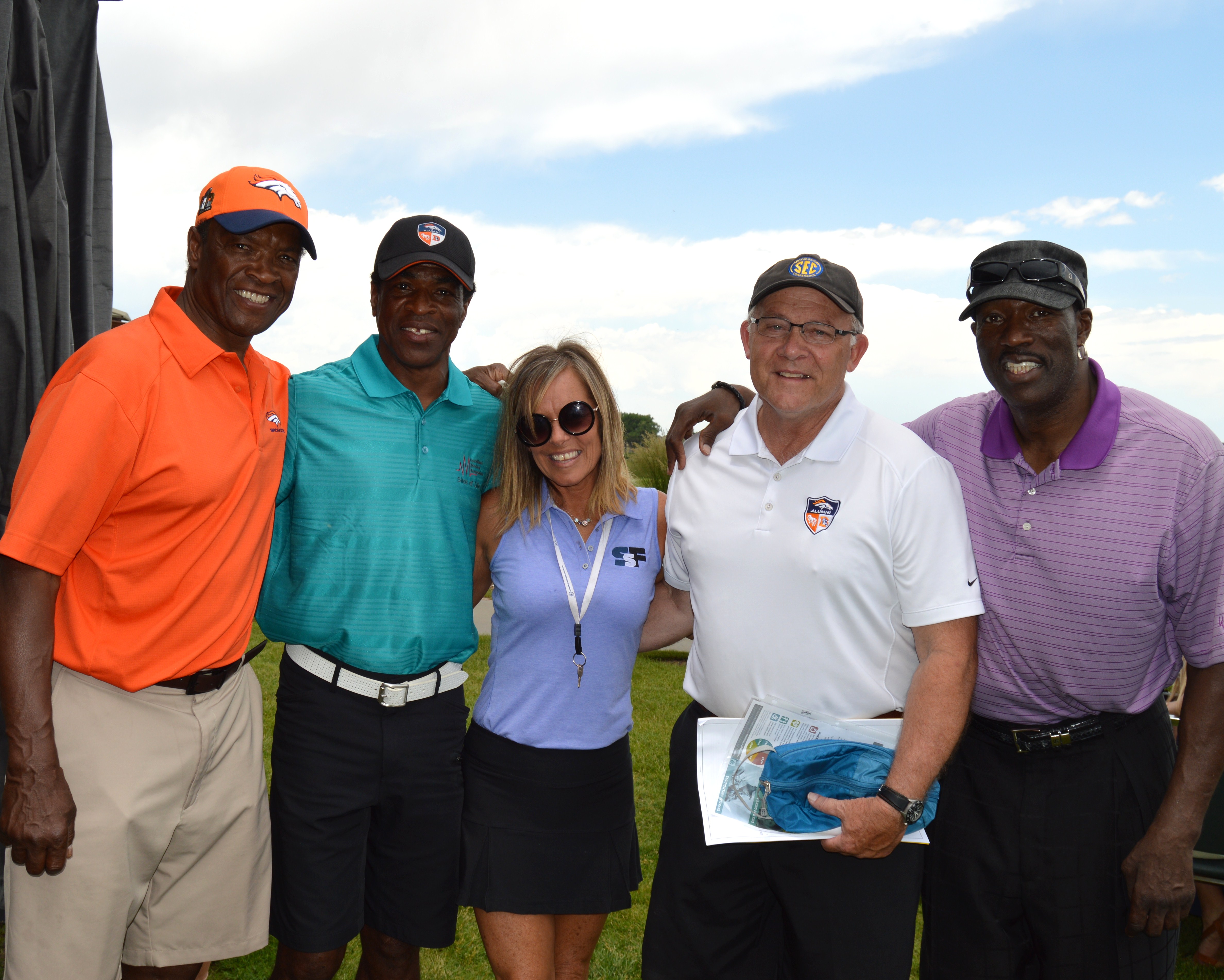 Development VP Teri Smith is one lucky girl, with Bronco greats (l to r ...