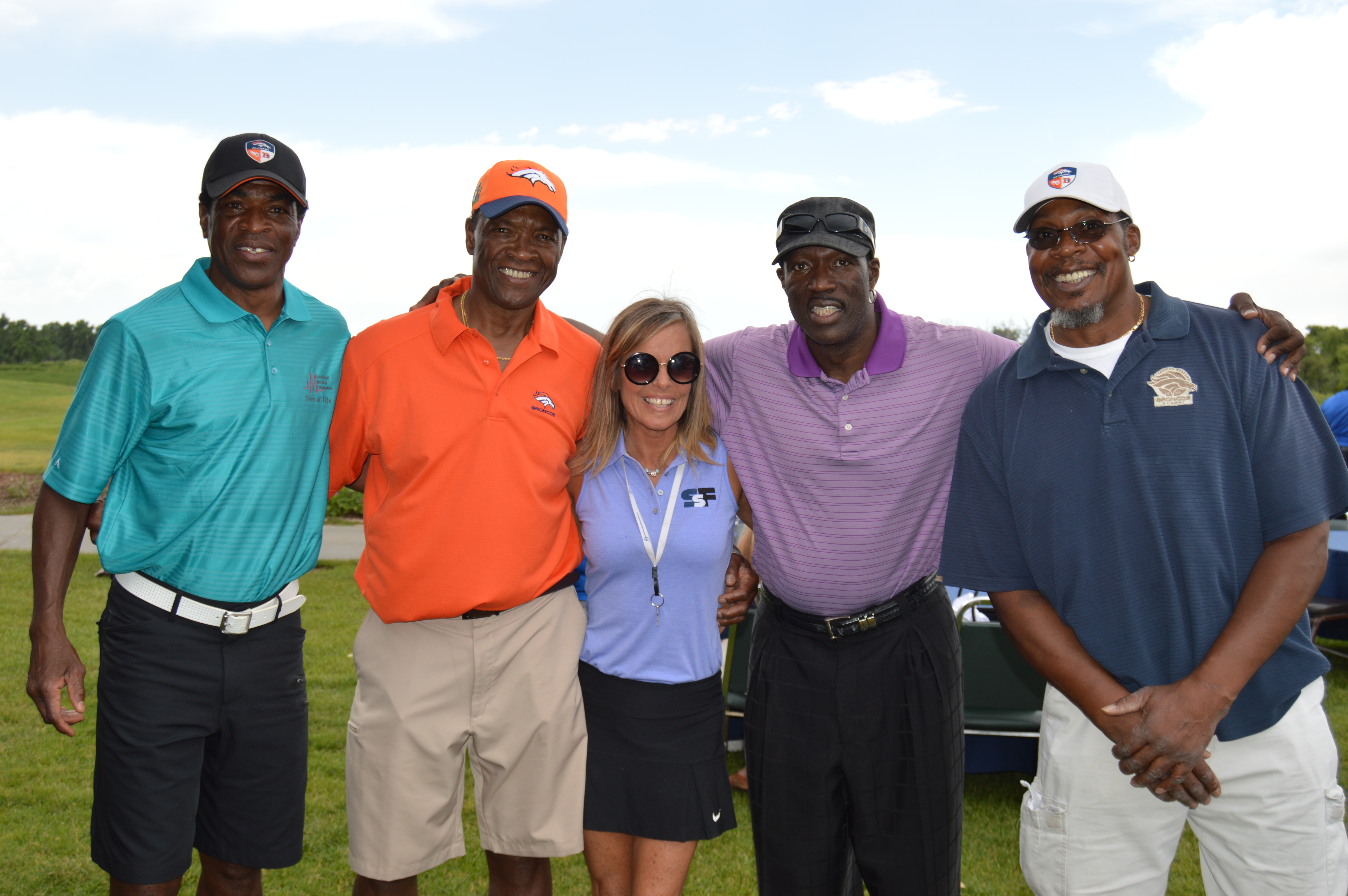Teri Smith, Development VP, is surrounded by Denver Broncos talent and ...