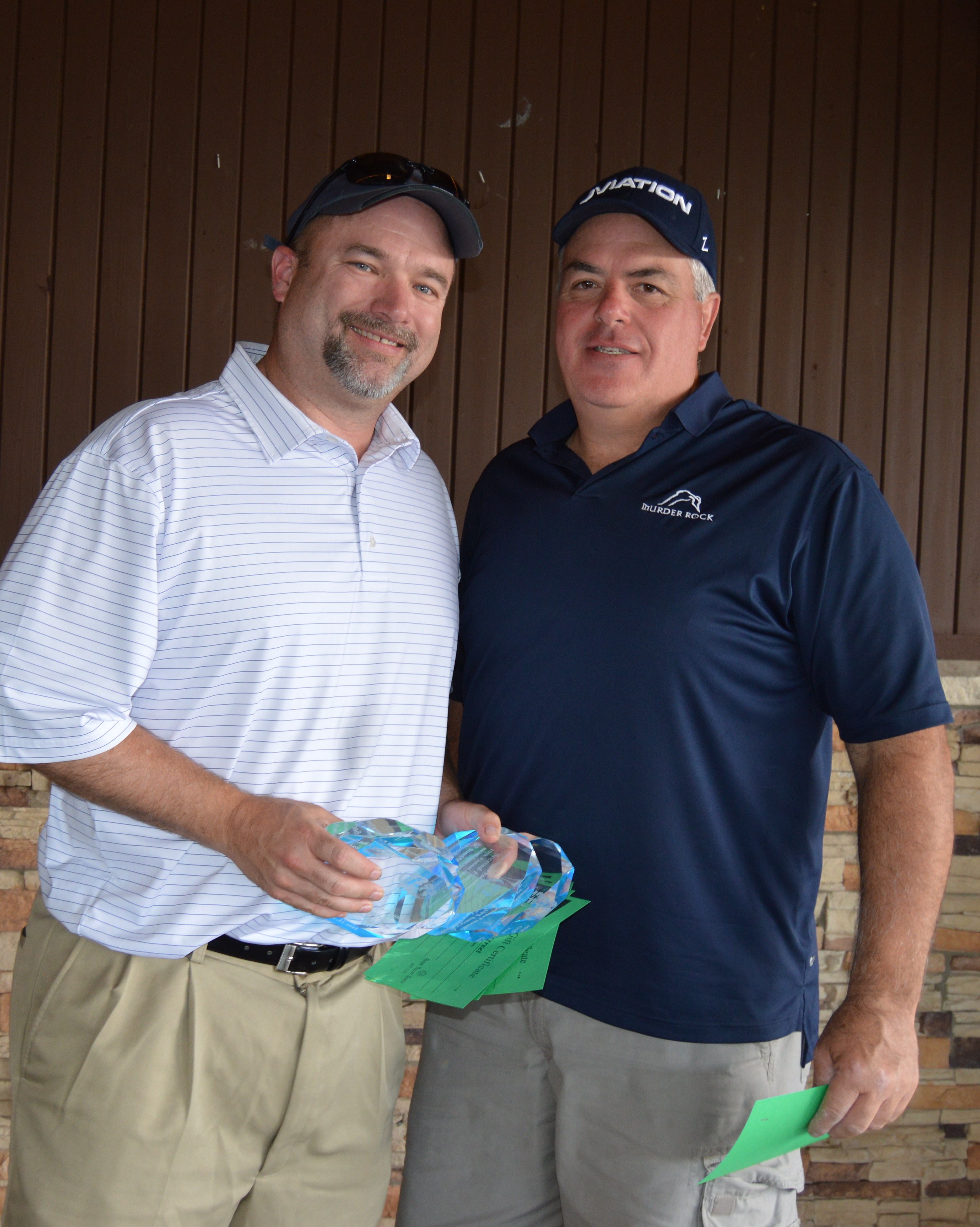 Dale Algrim (left) and Jim Trott pick up the trophies for their second ...