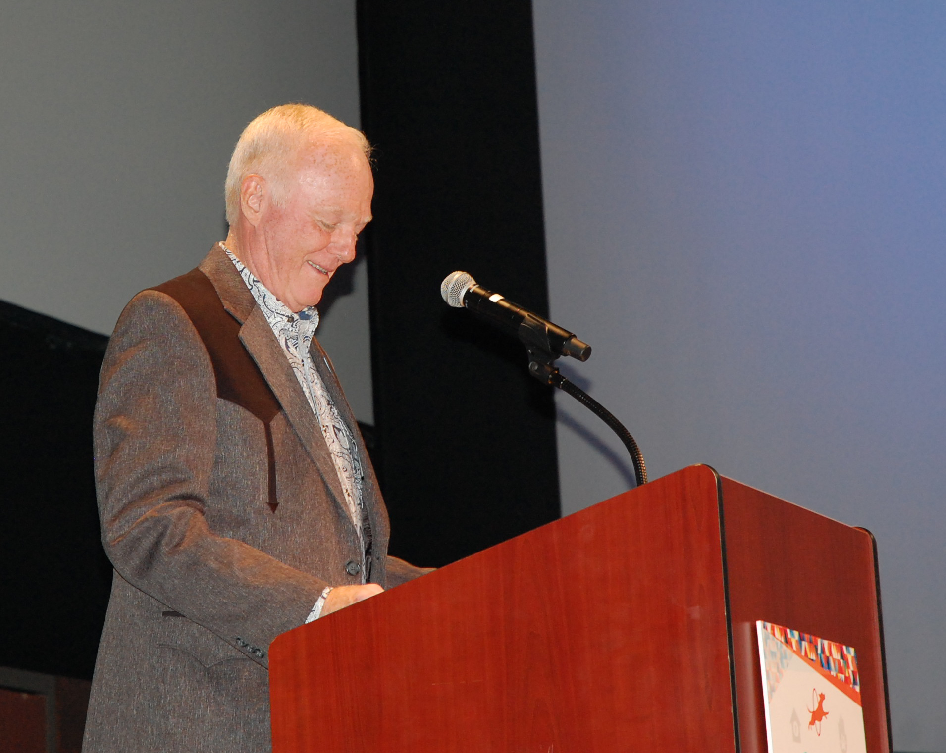 Board Chair Tom Scanlan talks to the crowd