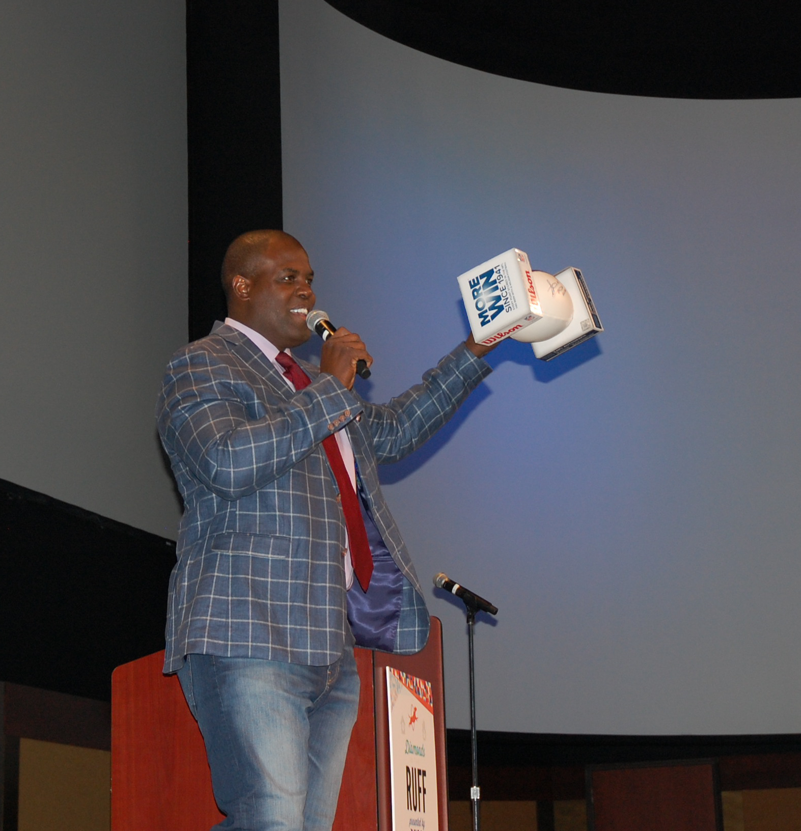 Reggie Rivers offers a Steve Atwater signed football