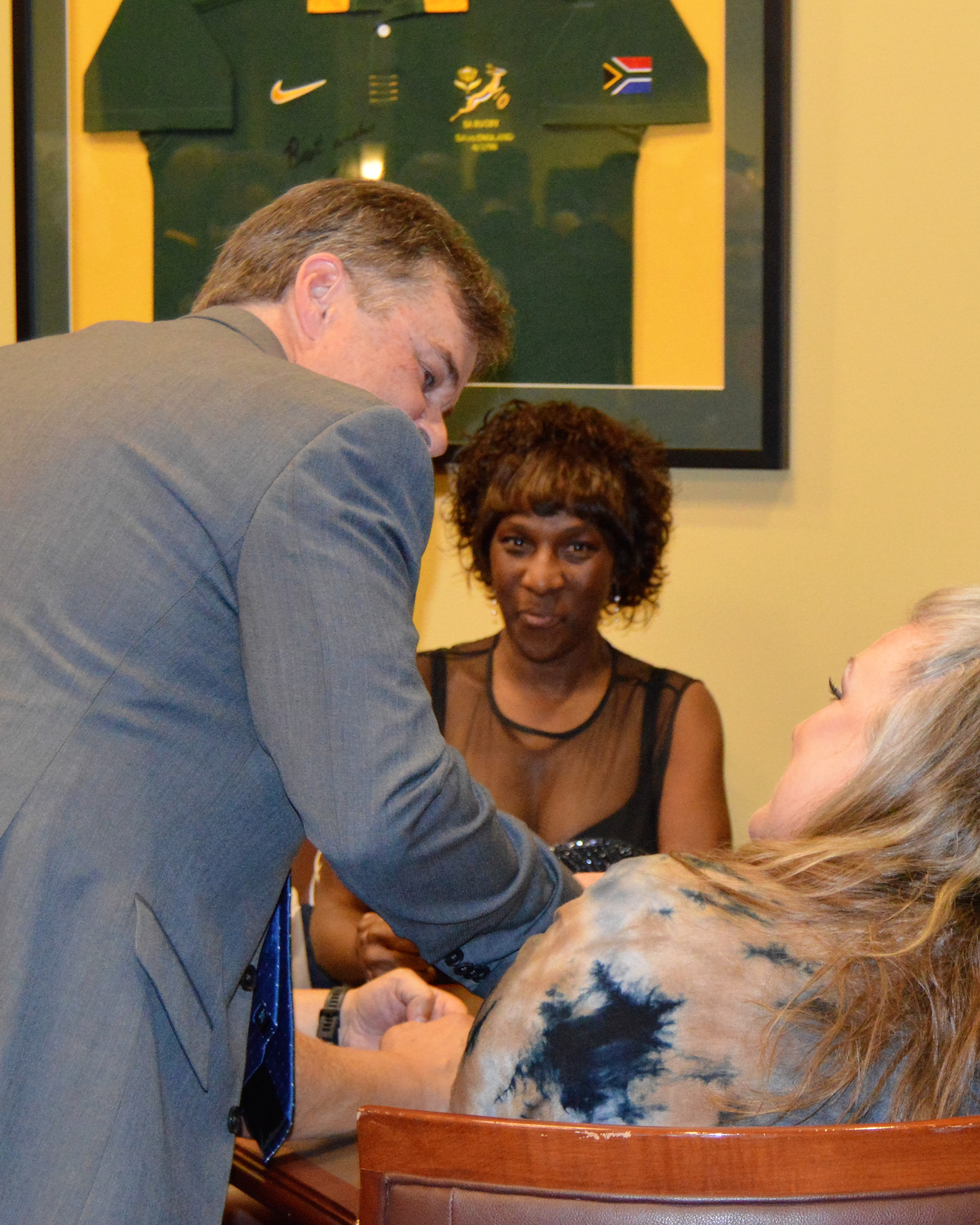 jAt the VIP reception, Christopher Conway stops by a table to say hello.