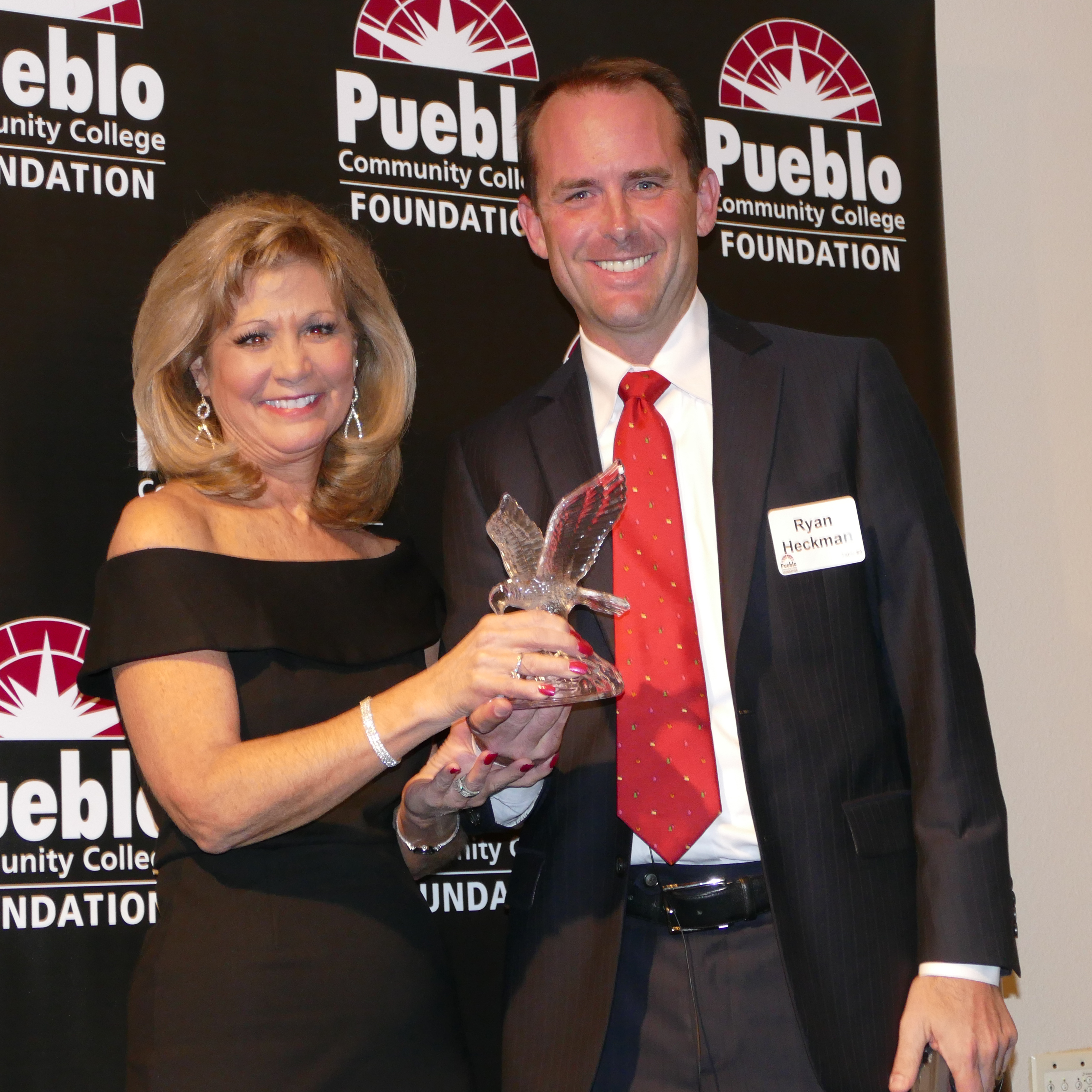 Dr. Patty Erjavec and Ryan Heckman, accepting the President's Circle ...