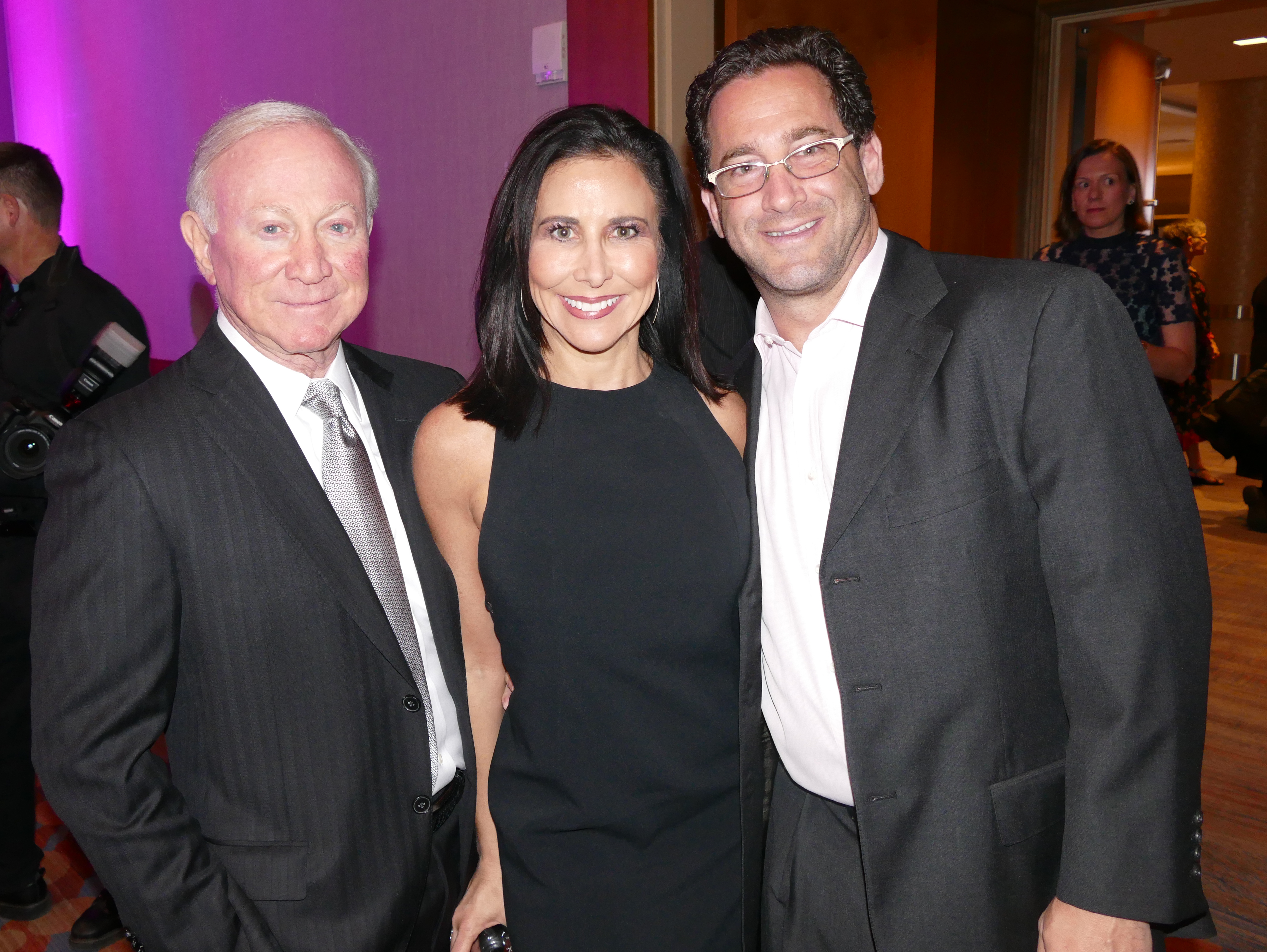 Larry Mizel, left, his daughter Courtney Mizel and Steve Guetterman