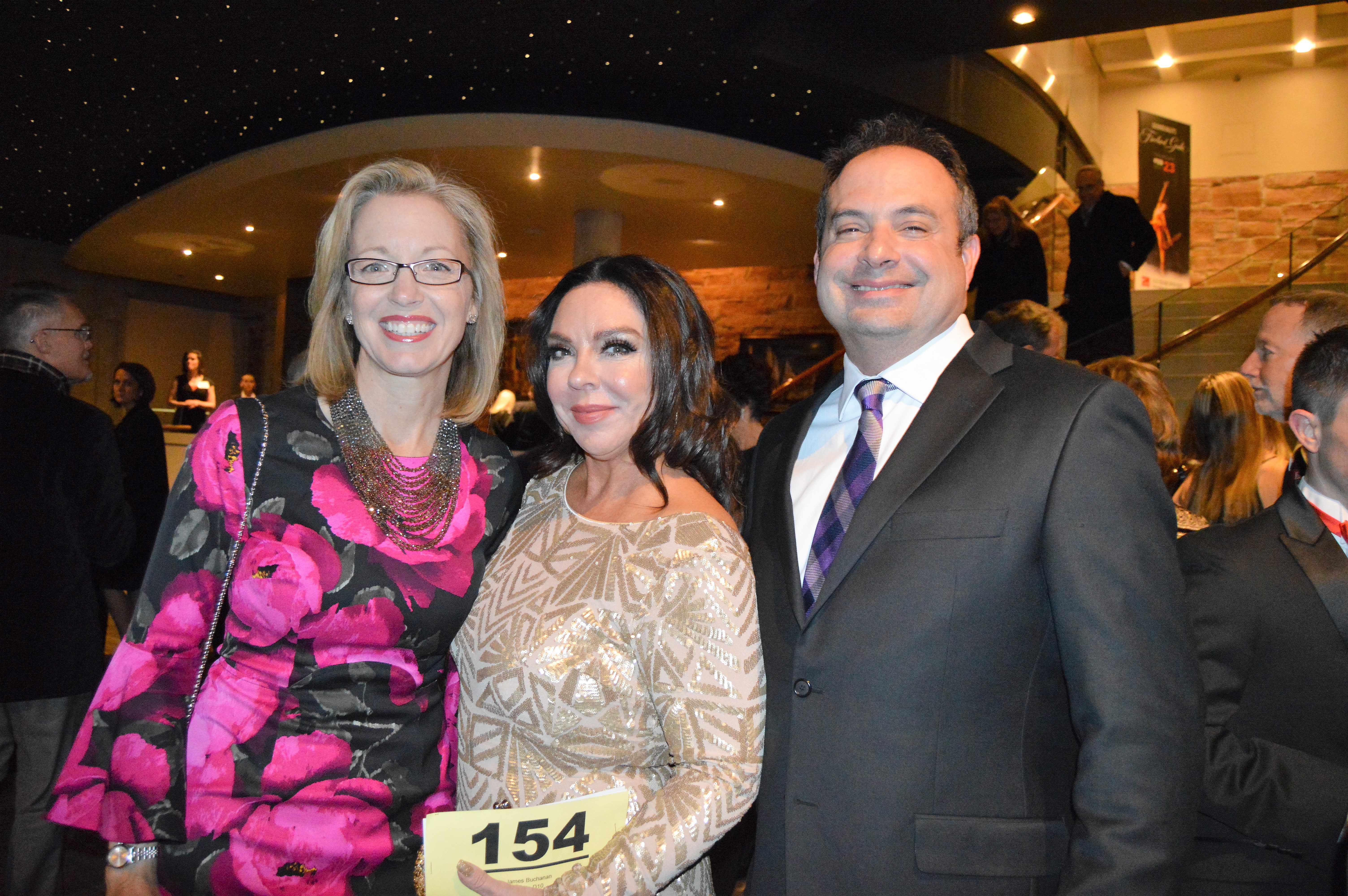 Board member Colleen Curran (left), with Suzanne and James Buchanan
