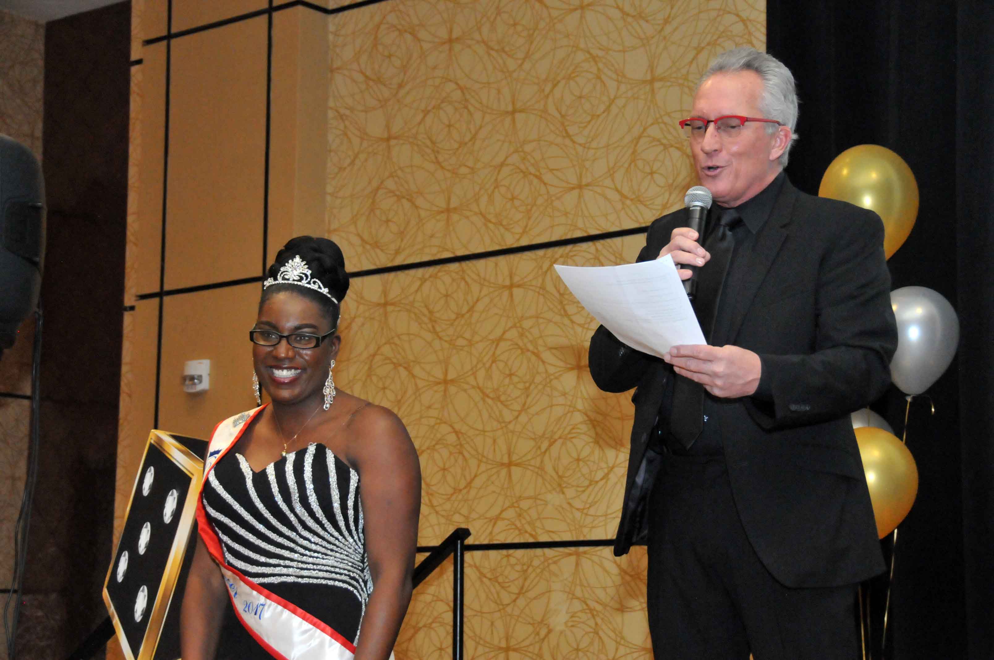 Mrs. Denver Michelle Smith assists with the live bidding