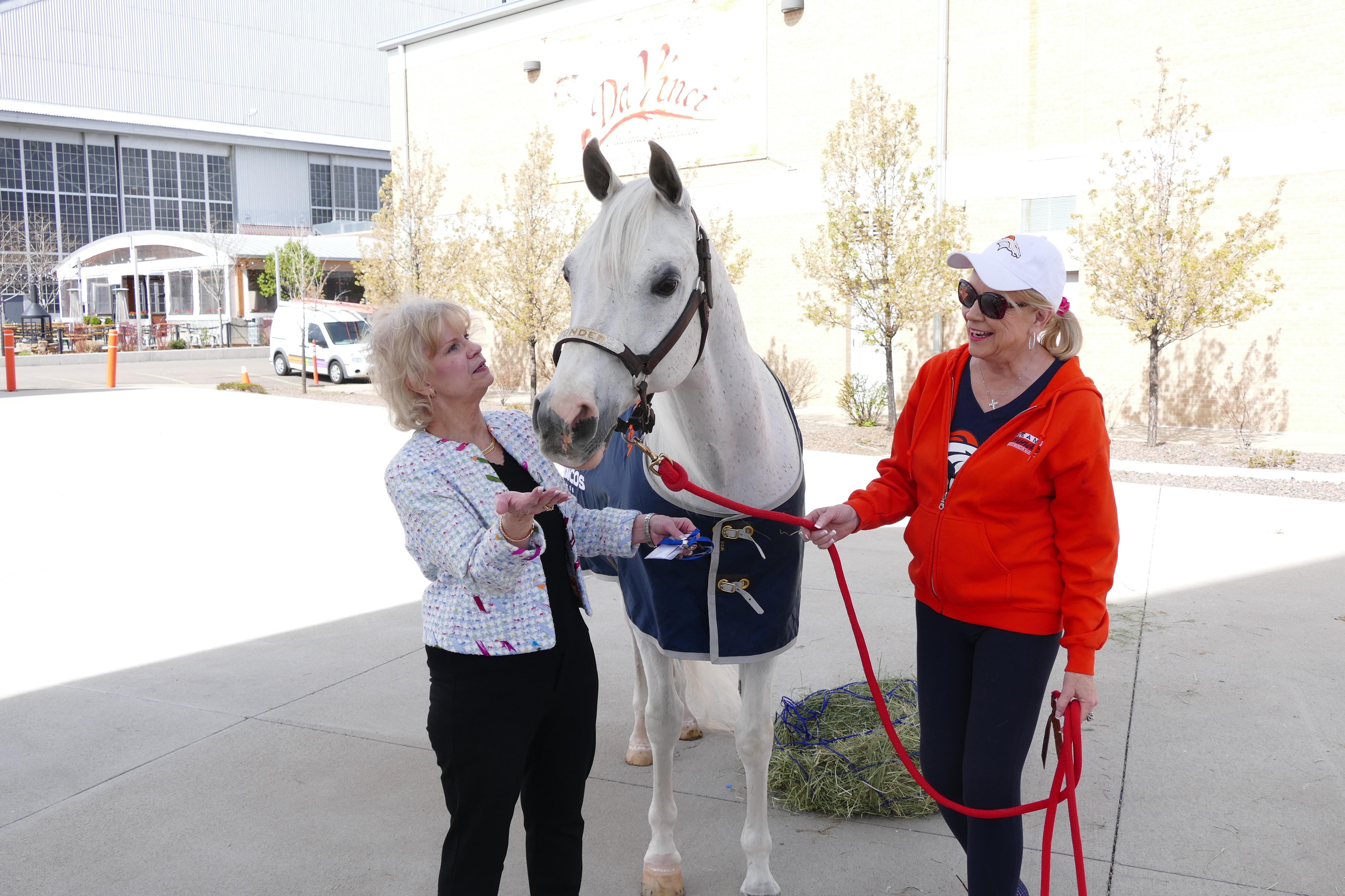 Event Chair Lyn Schaffer, left, with Thunder and Sharon Magness Blake