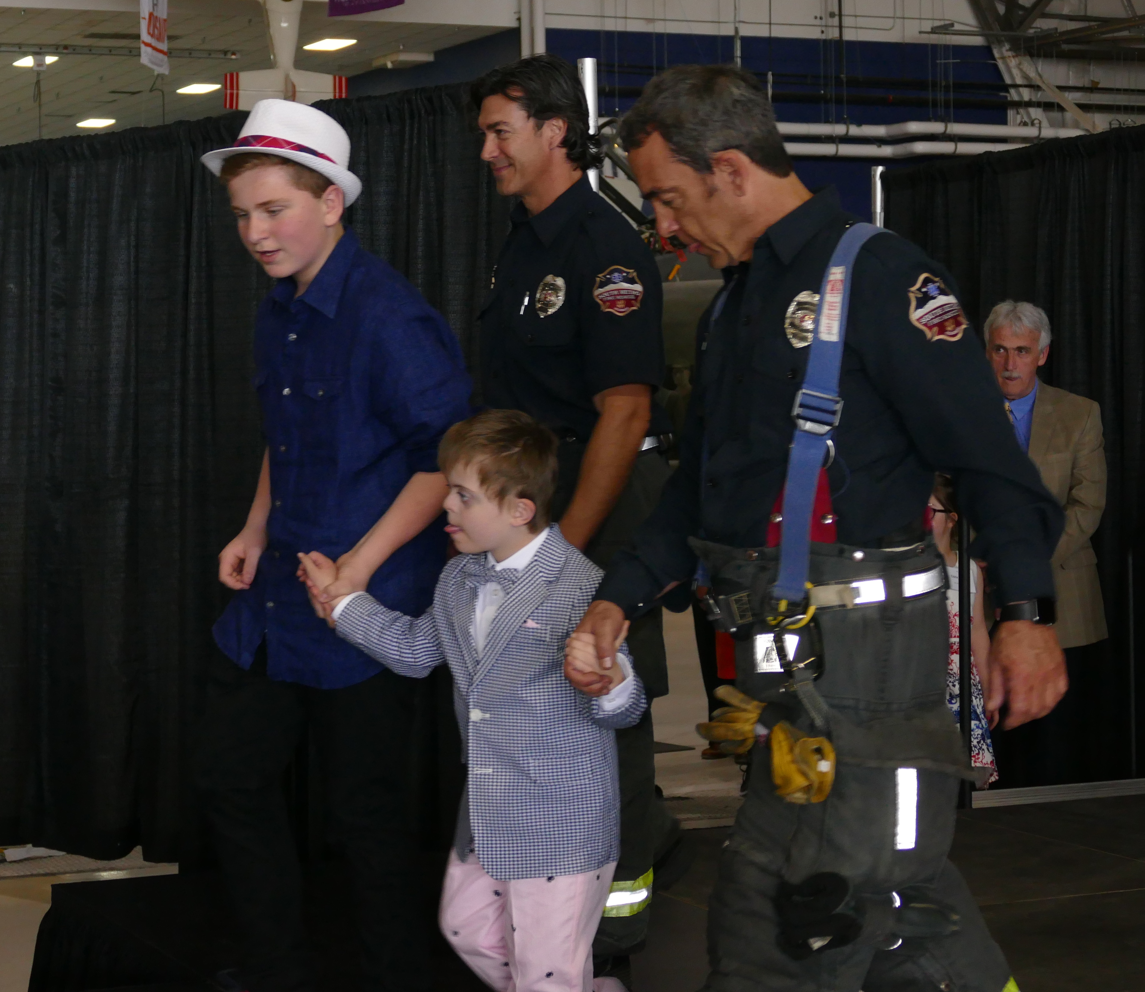Jack and Thomas take the stage with firefighters
