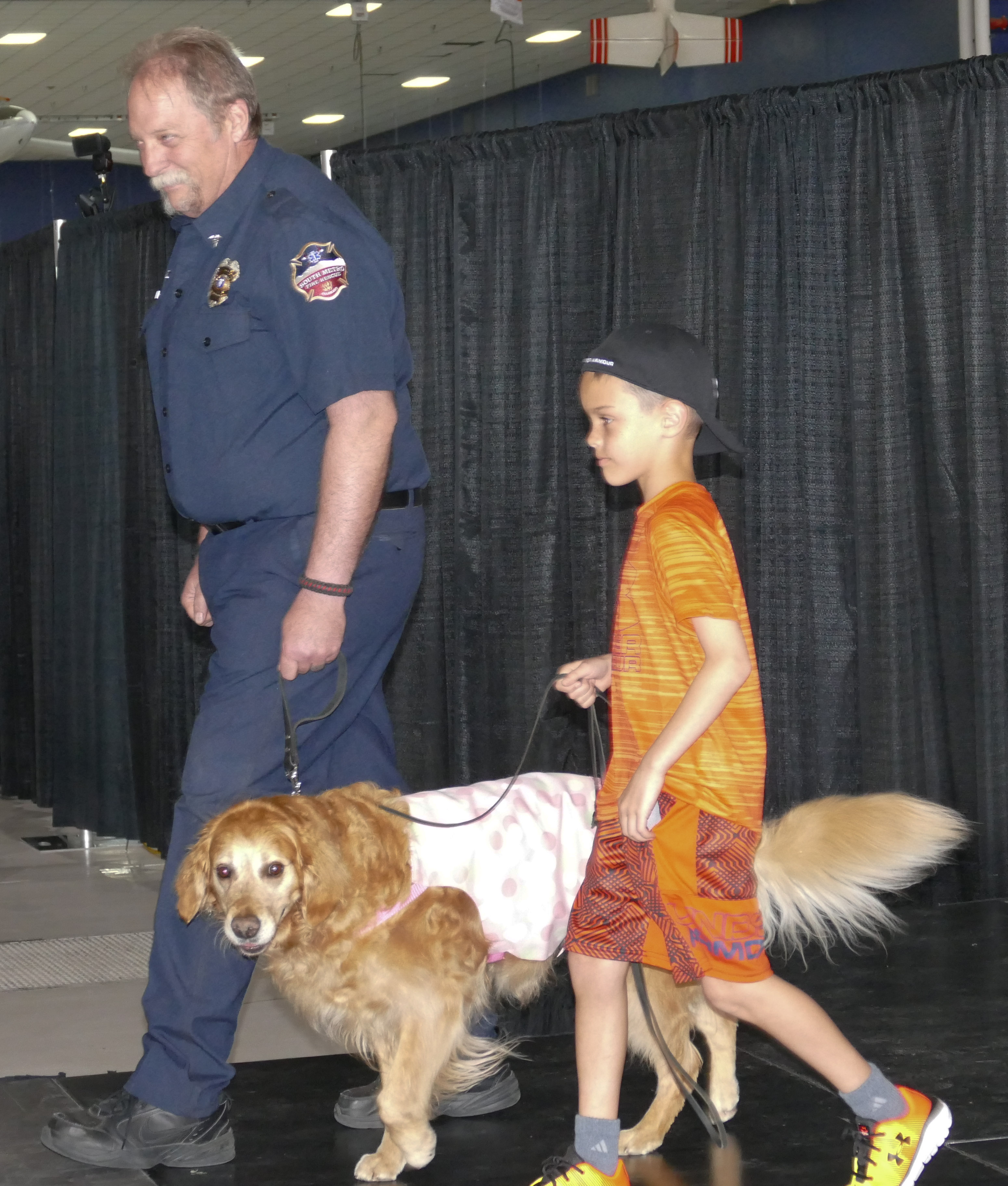Firefighter Eric Bleeker and Max Black take the stage with Emma