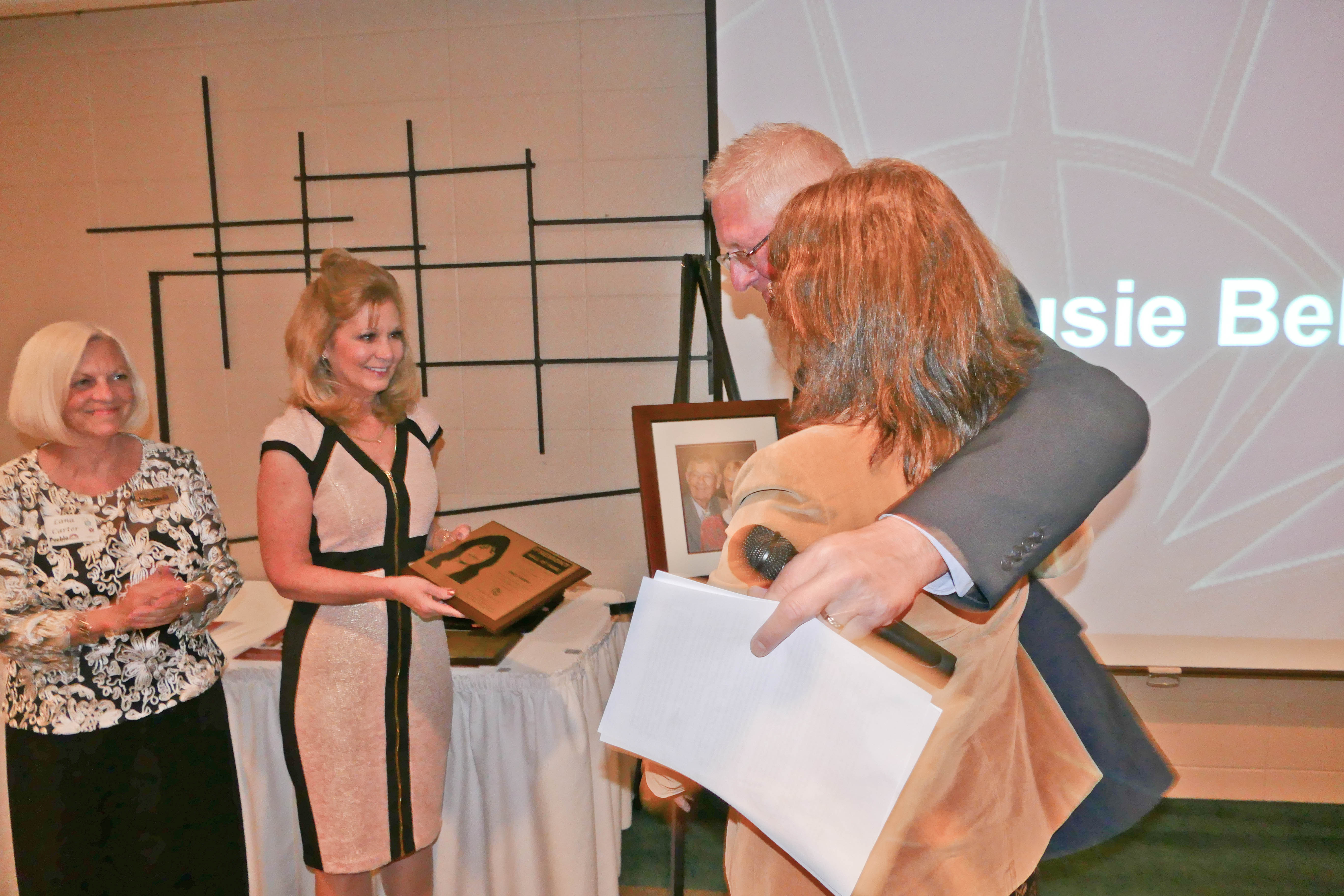 Judy Lohnes gets a hug from Ed Norden as Dr. Lana Carter and Dr. Patty ...