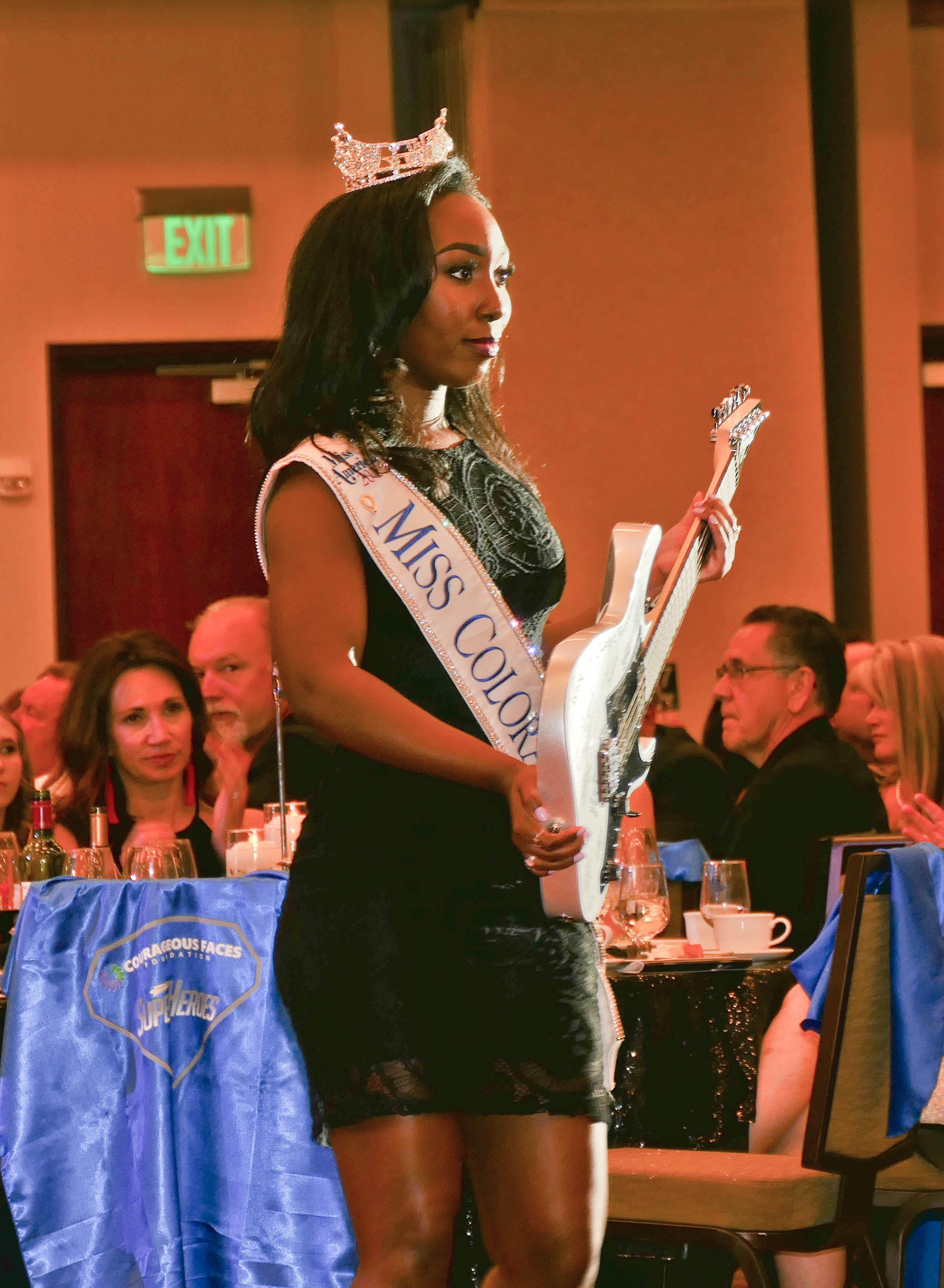 Miss Colorado Shannon Patilla holds an autographed guitar from the ...
