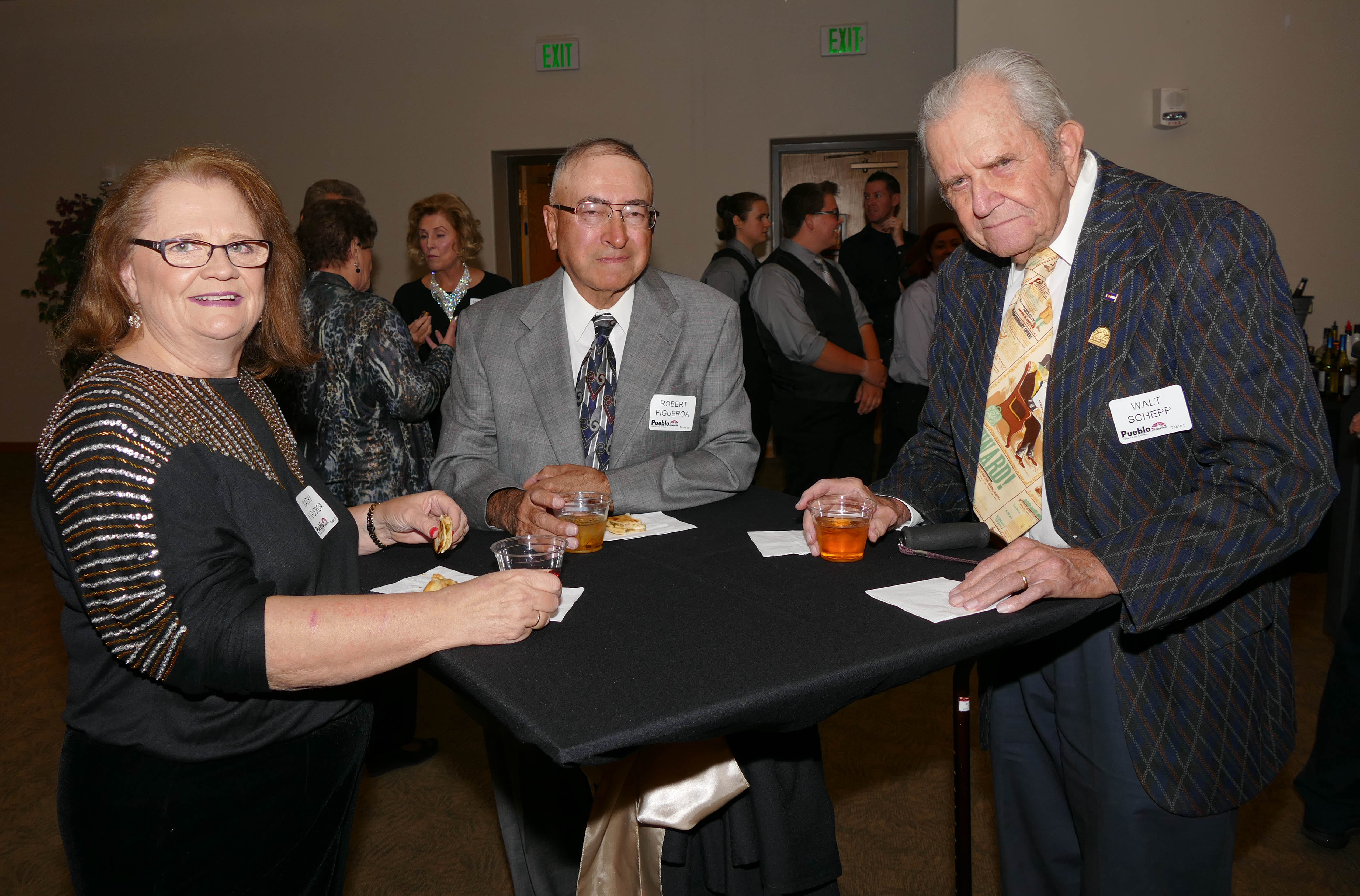 Kathy and Robert Figueroa, left, with Walt Schepp