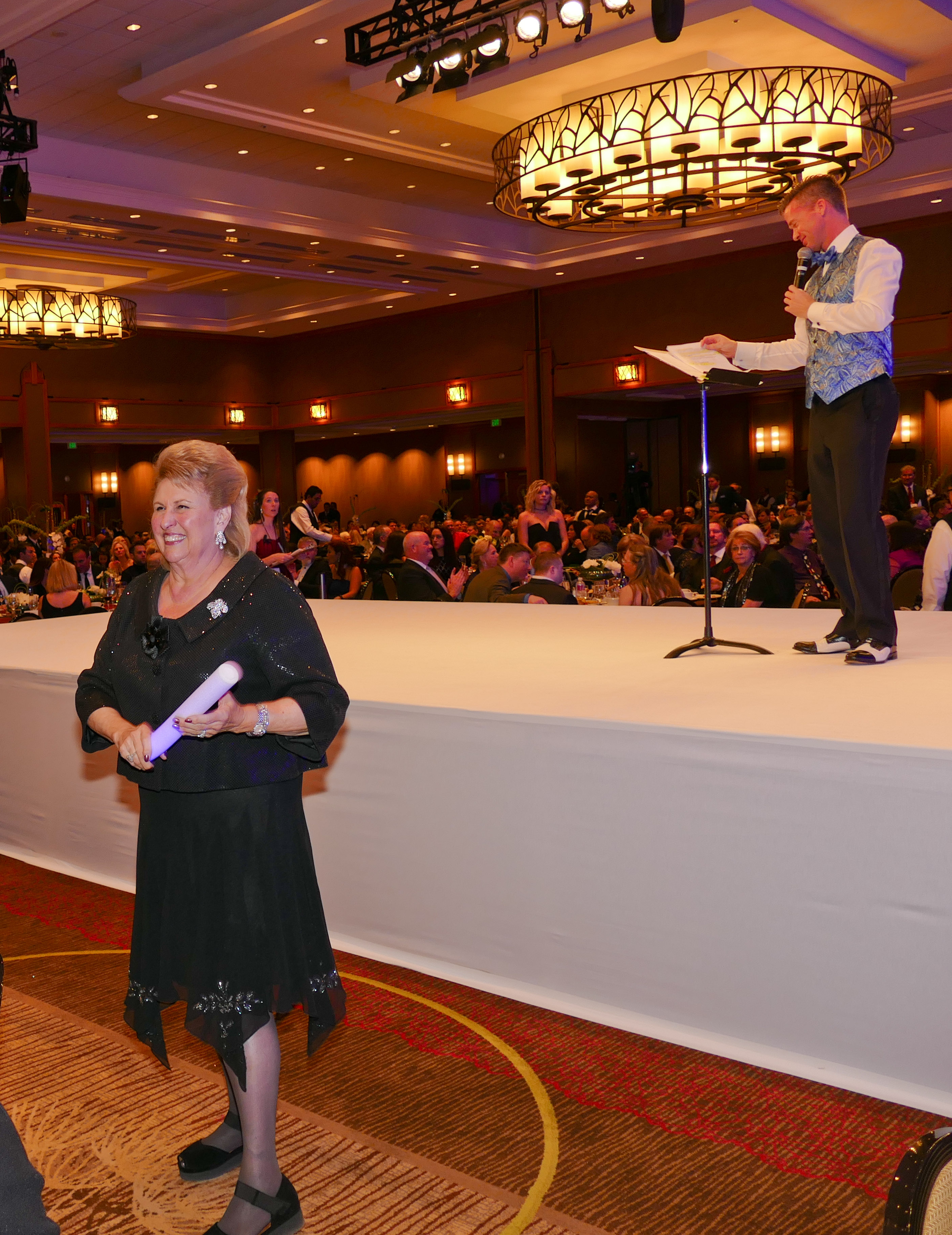 Edie Marks watches for auction bidders