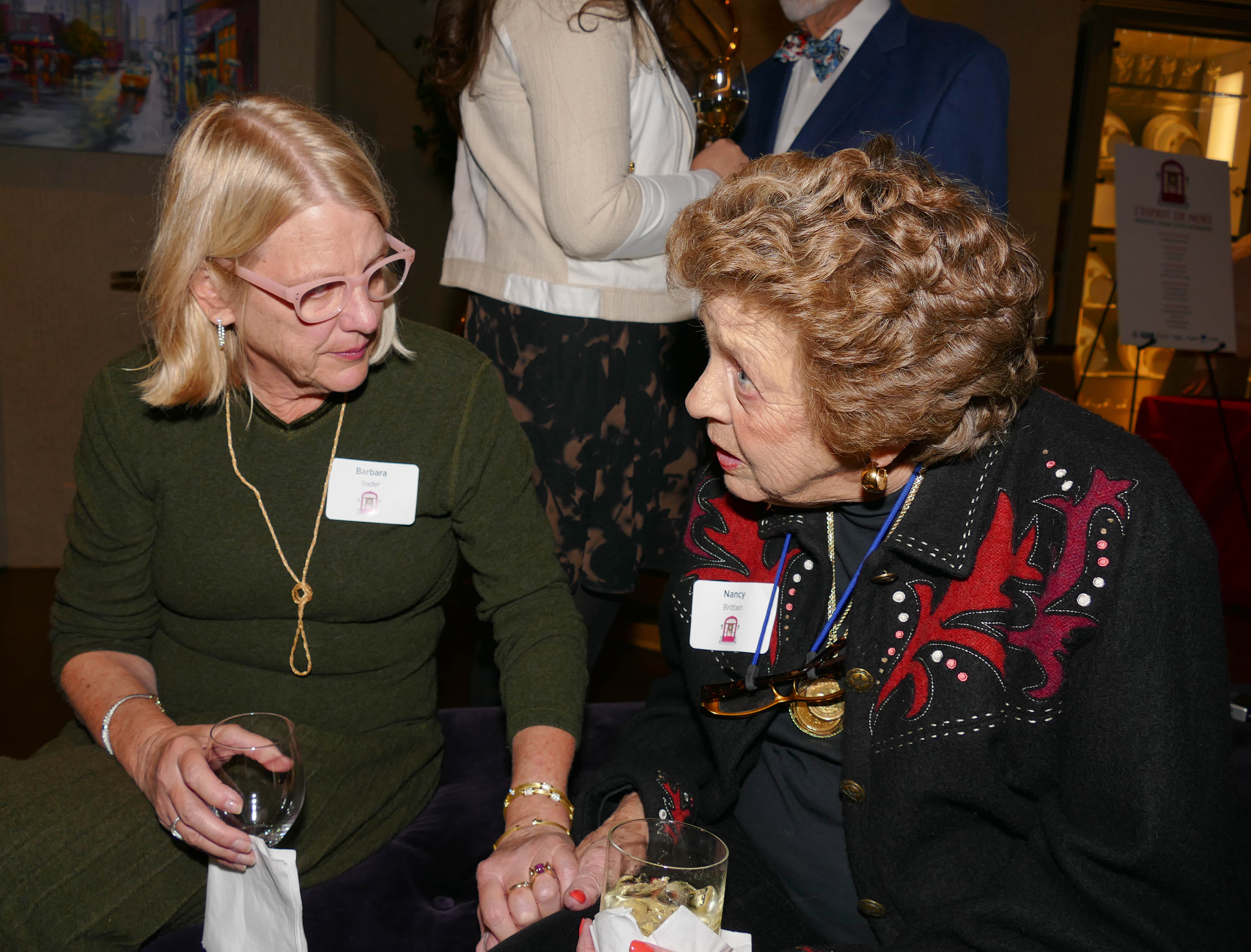 Barbara Bader, left, talks with Nancy Brittain