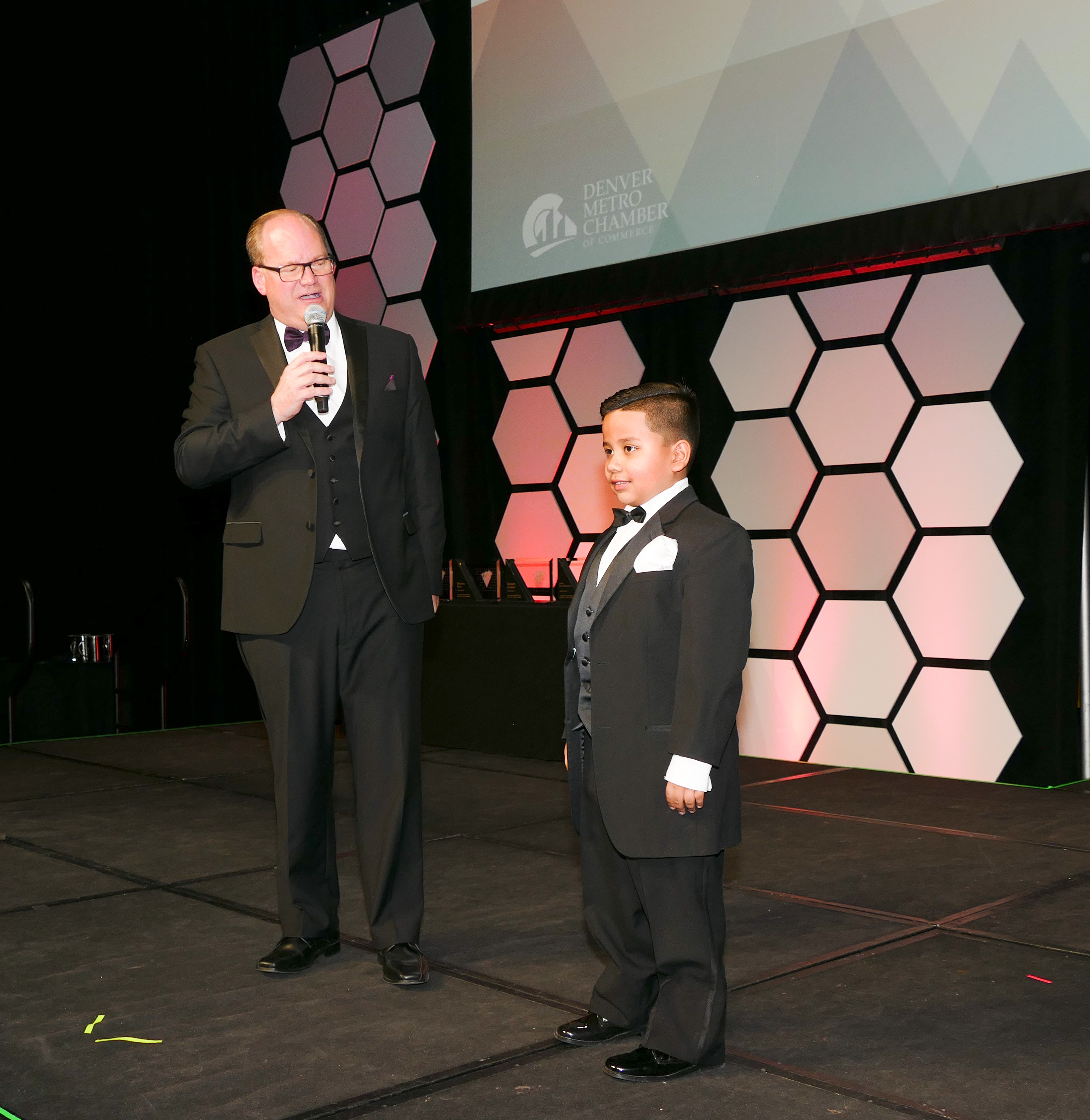 Emcee Gregg Moss talks to Gianni on stage
