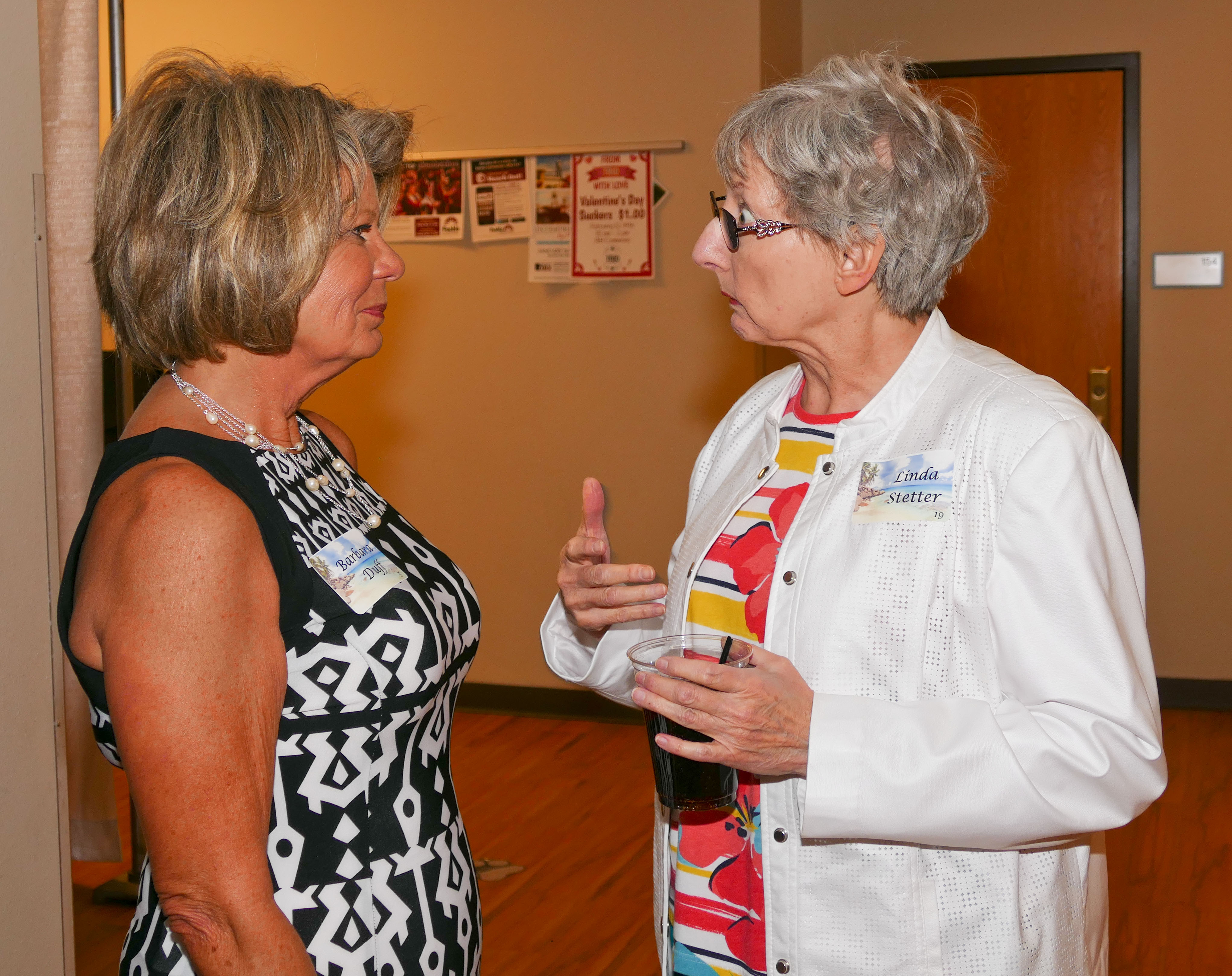 Barbara Duff, left, chats with Linda Stetter