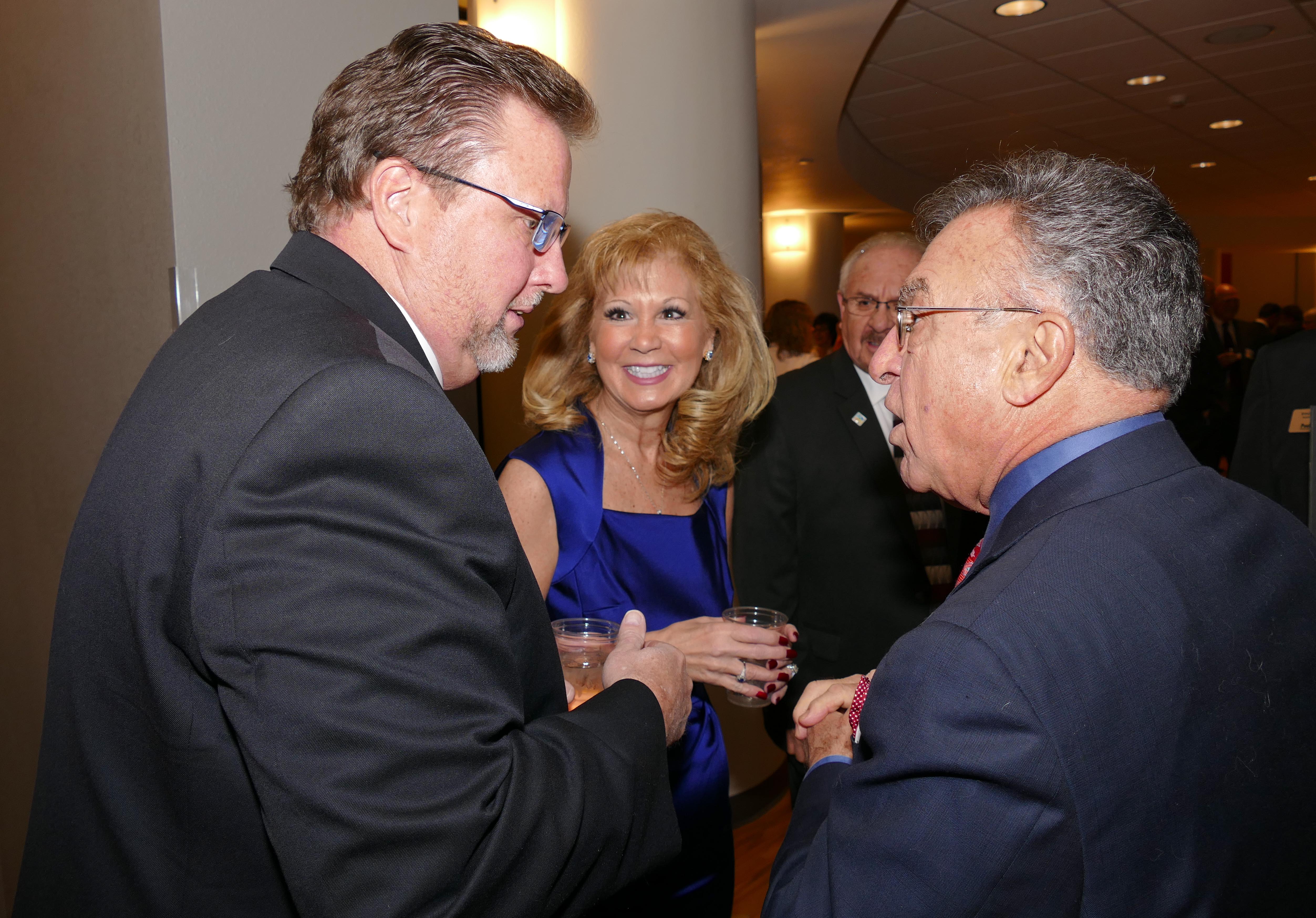 Ray and Dr Patty Erjavec share a laugh with Mike Salardino (HOF '17)
