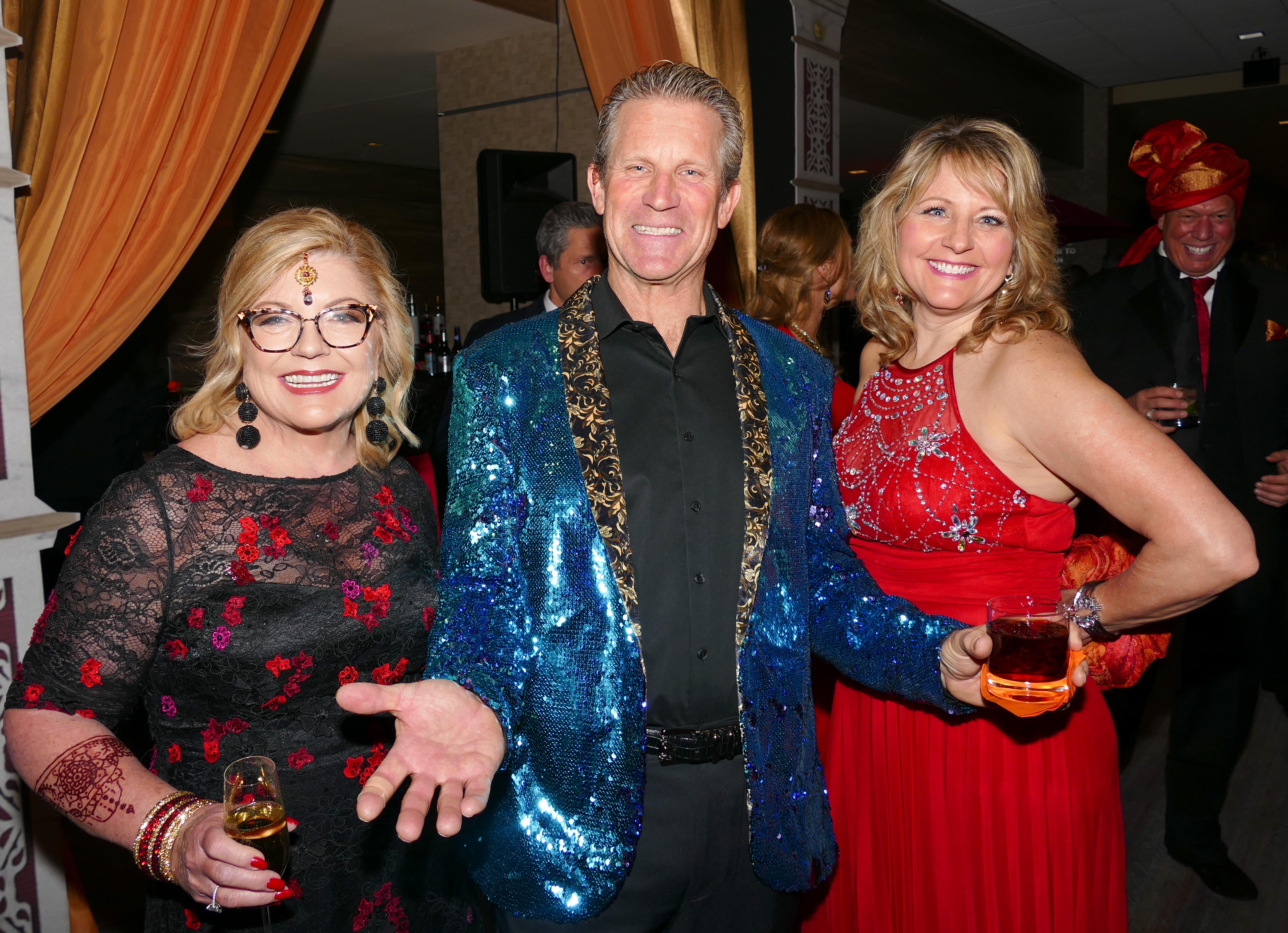 Gloria Dittus, left, John Morgridge and Stephanie Welsh