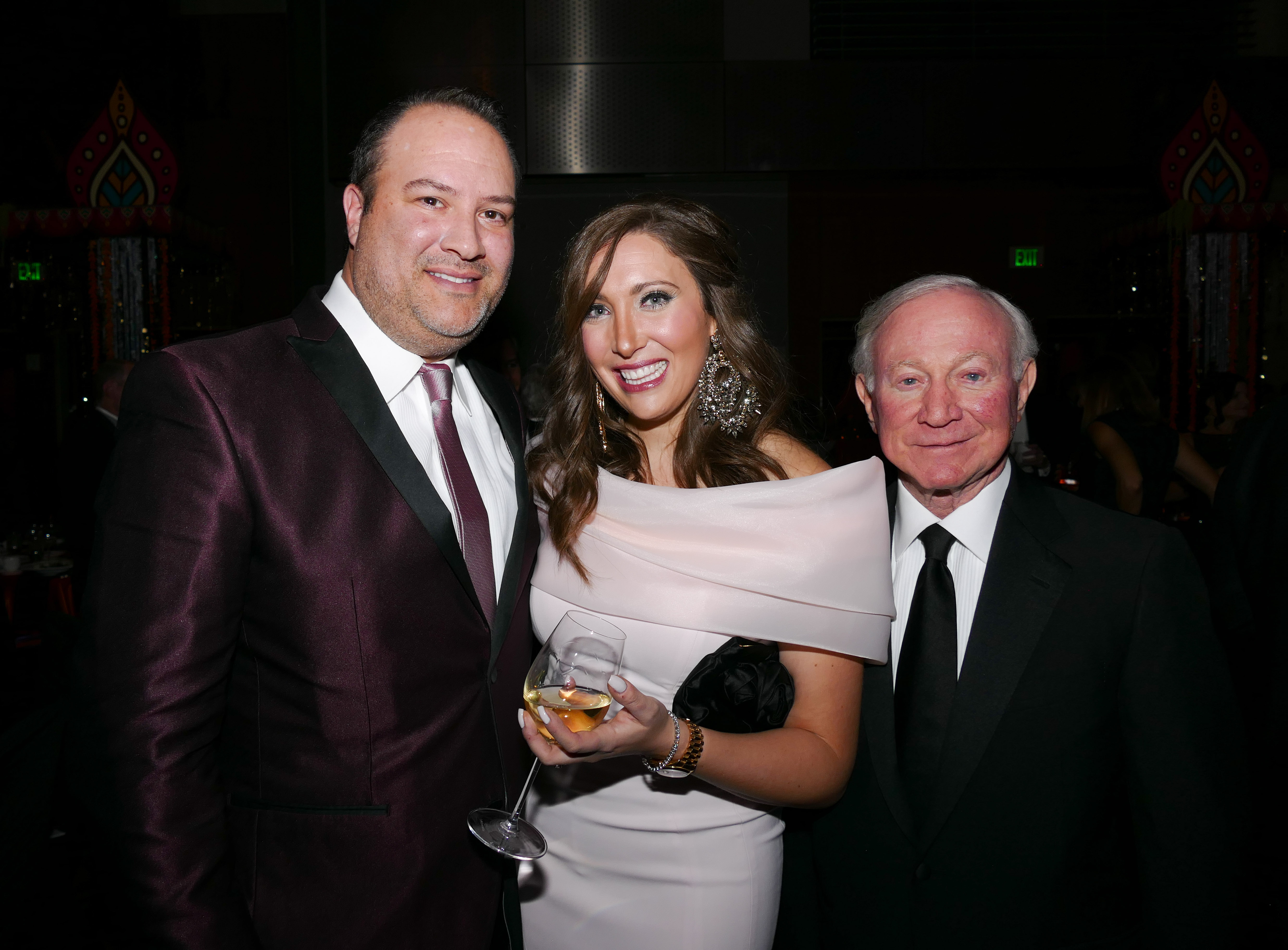 David and Lisa Walko, left, with Larry Mizel