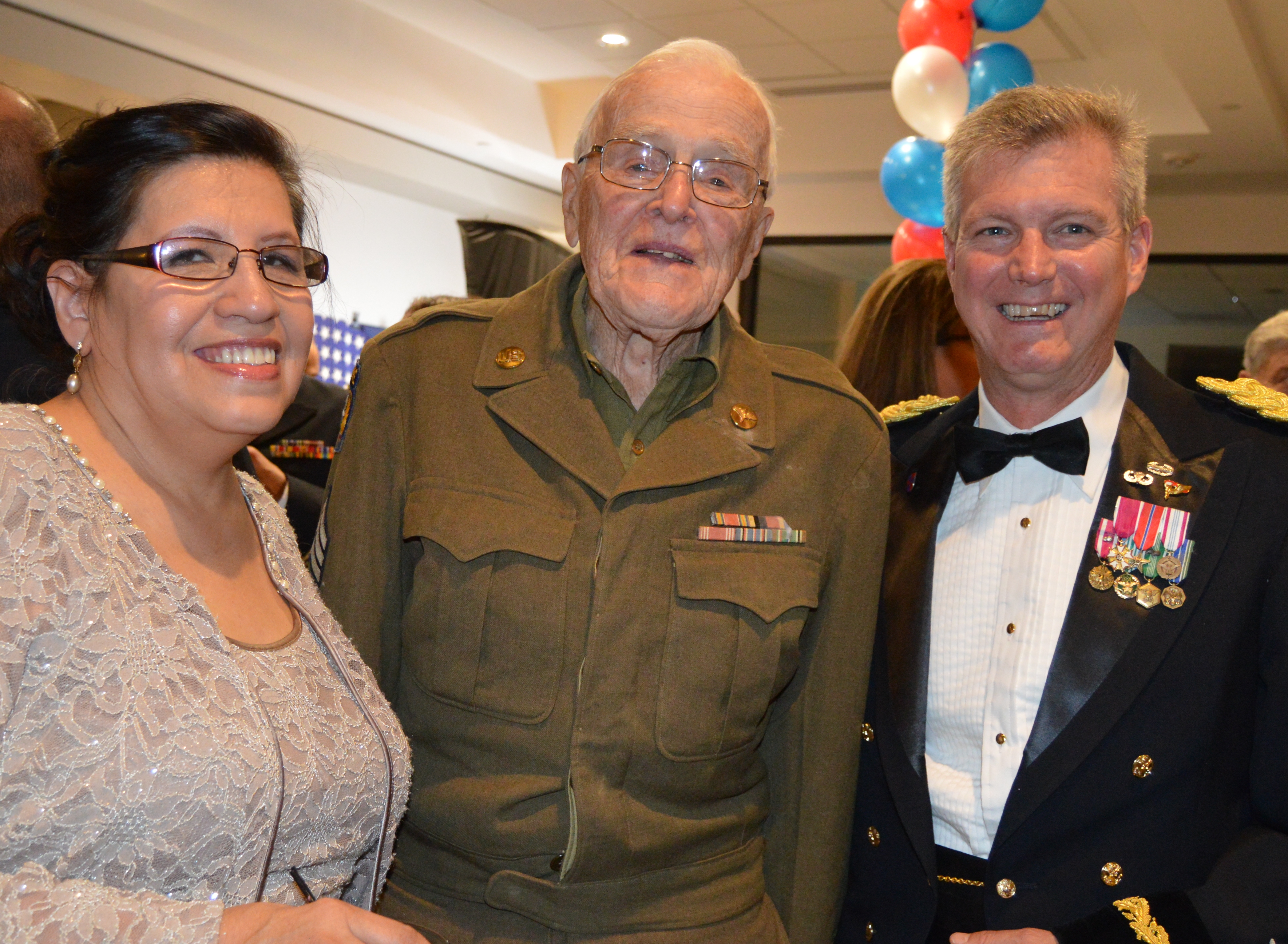 (l to r): Vicki Imeraj, WWII event honoree Sgt. (Ret.) George Faust and ...