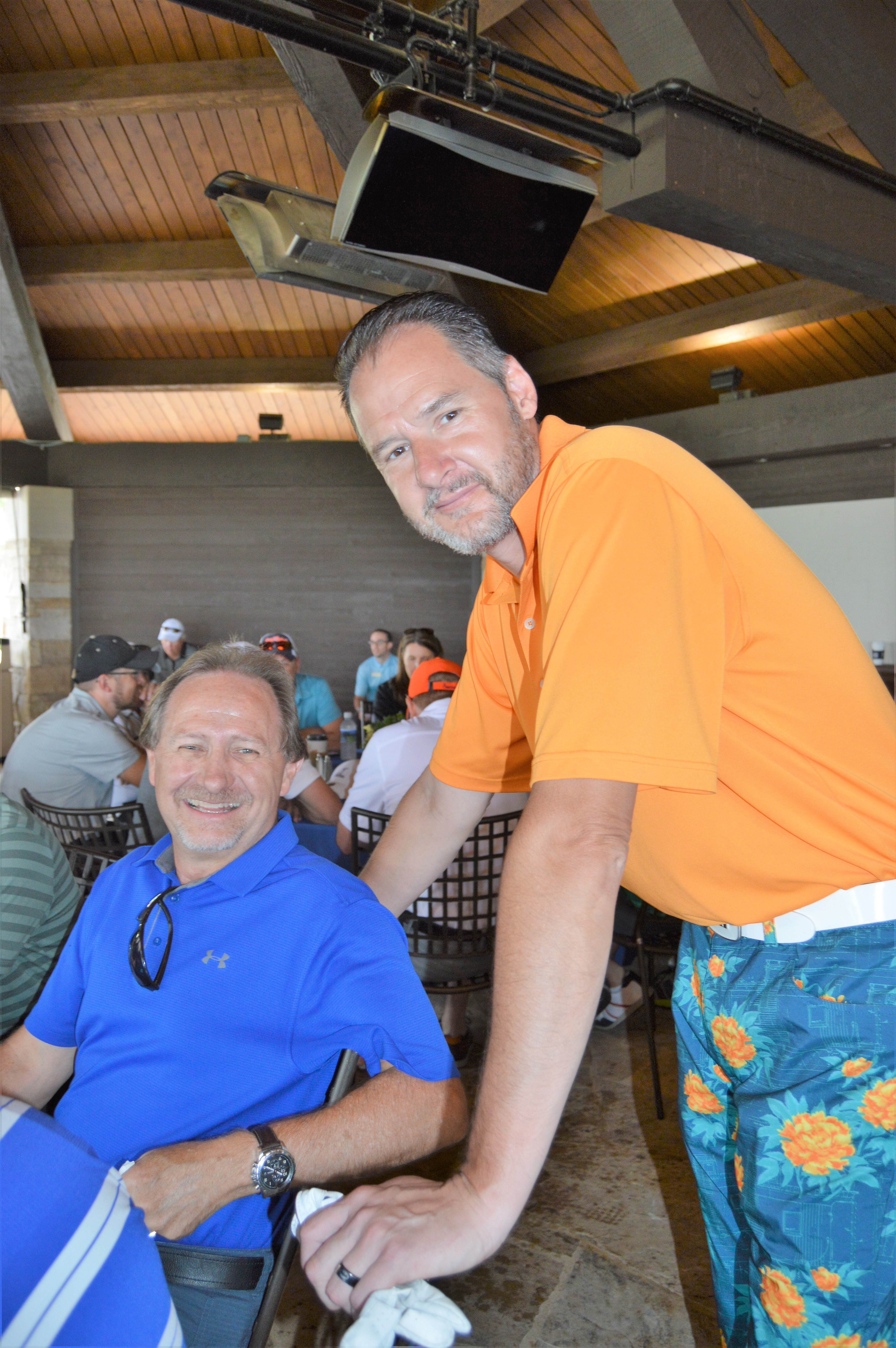Dave Betts' orange shirt and print pants was the outfit of the day.
