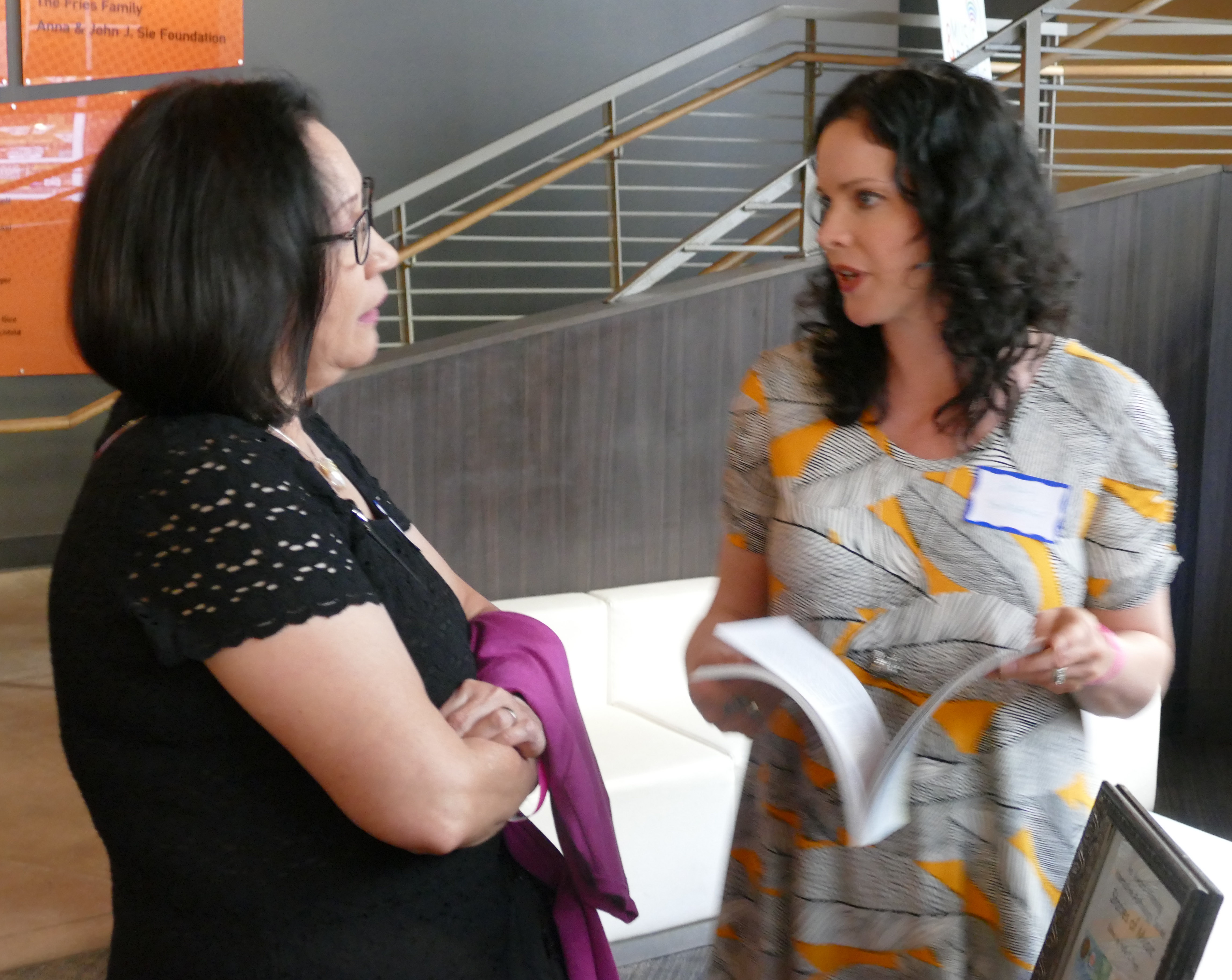 Madeline Drohan, left, talks with Holly Tripp about Holly's books