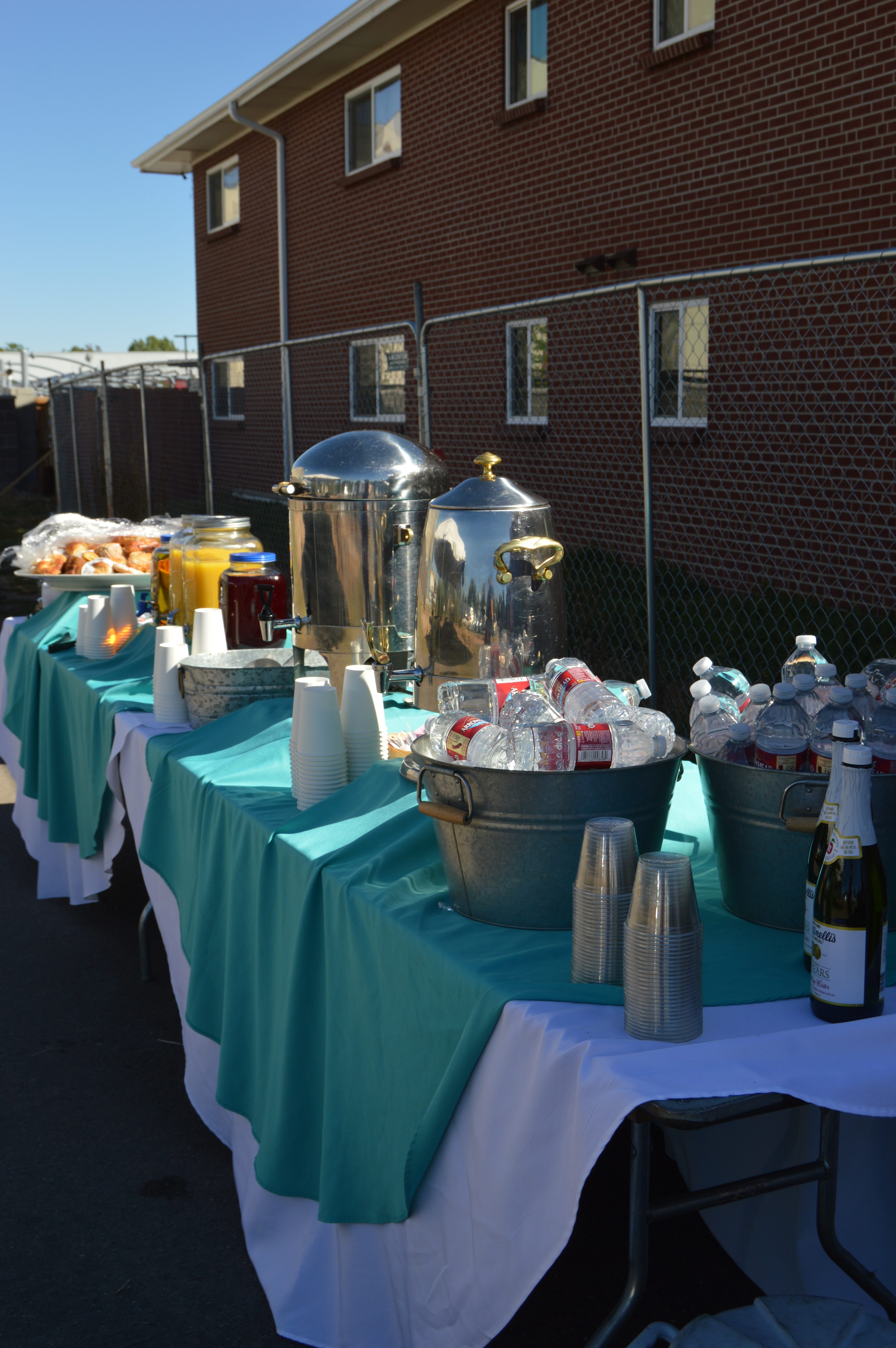 A buffet brunch with cold beverages on a warm day