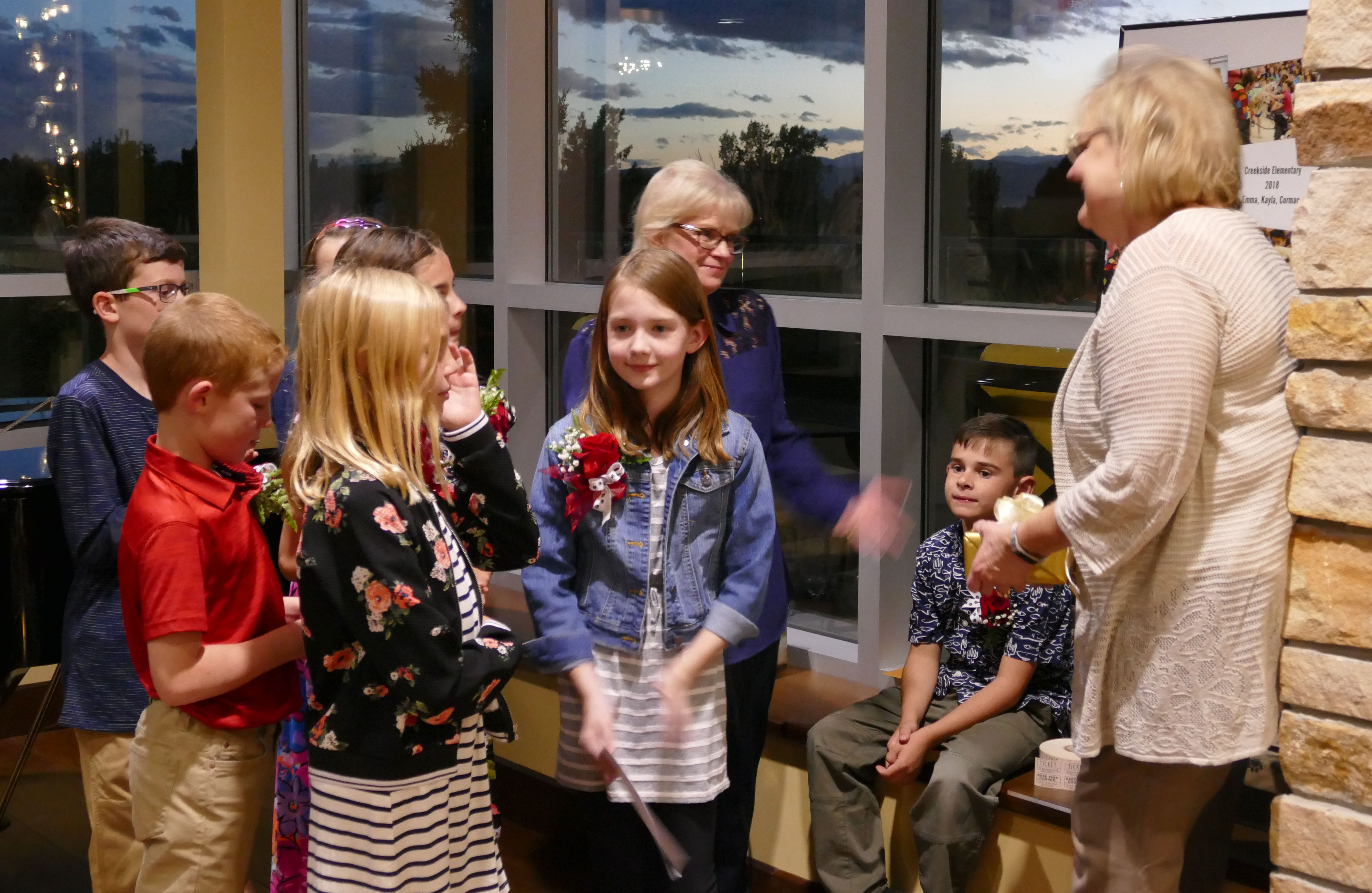 Students, Lyn Schaffer and Dr. Sara Mark hold the raffle