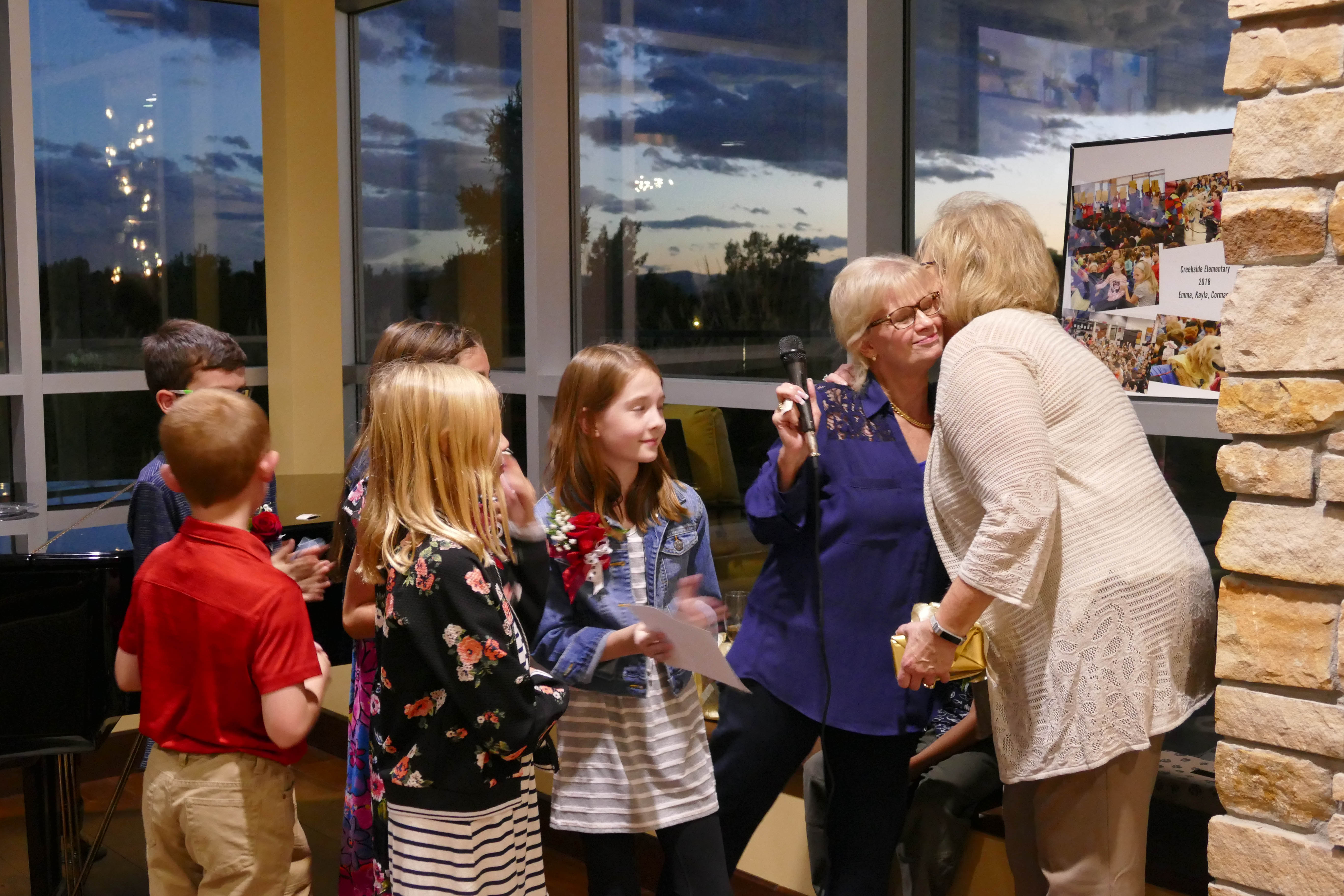 Lyn Schaffer gives a hug of appreciation to Dr. Sara Mark