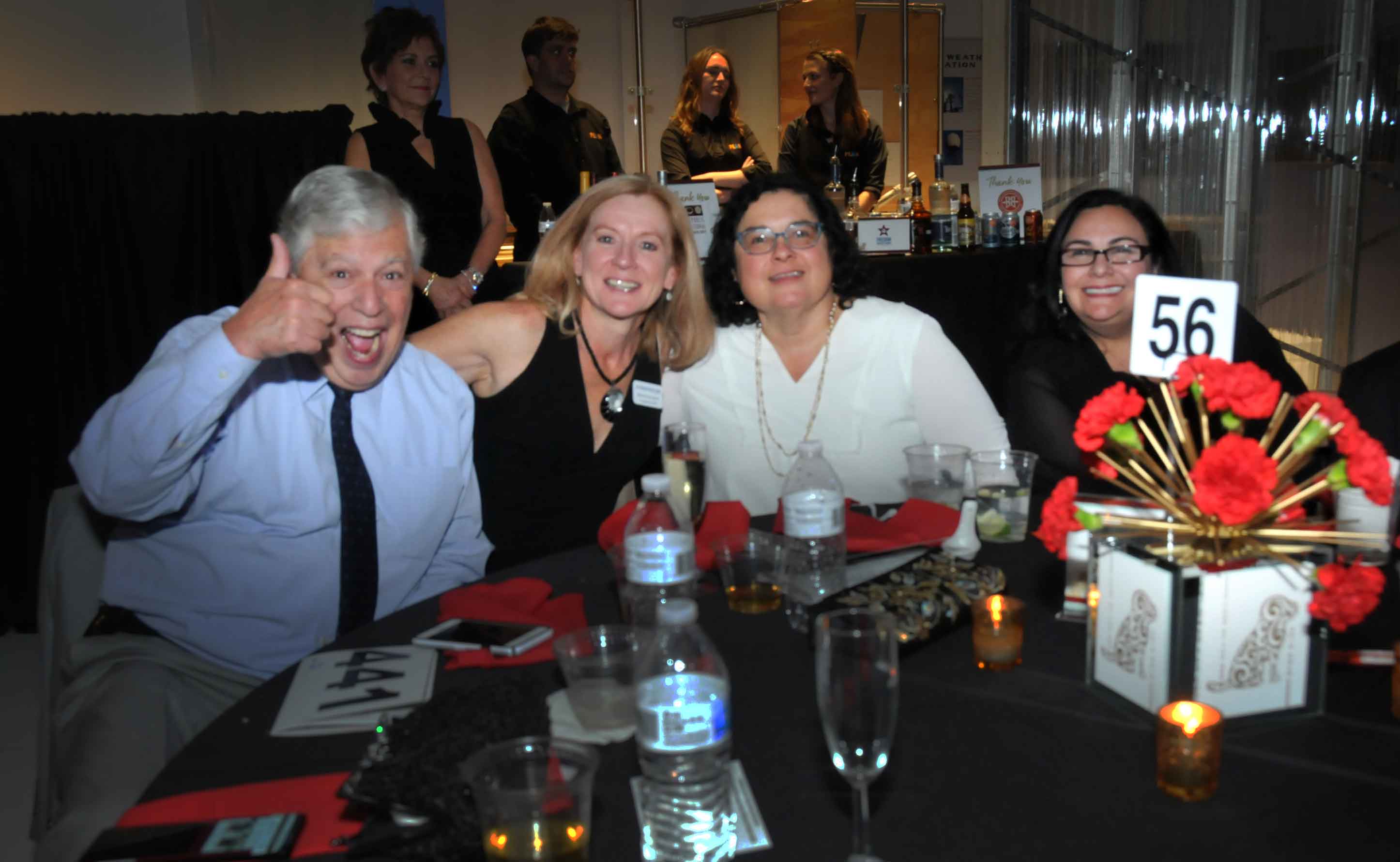 Freedom Service Dogs President/CEO Michele Ostrander (center) with friends