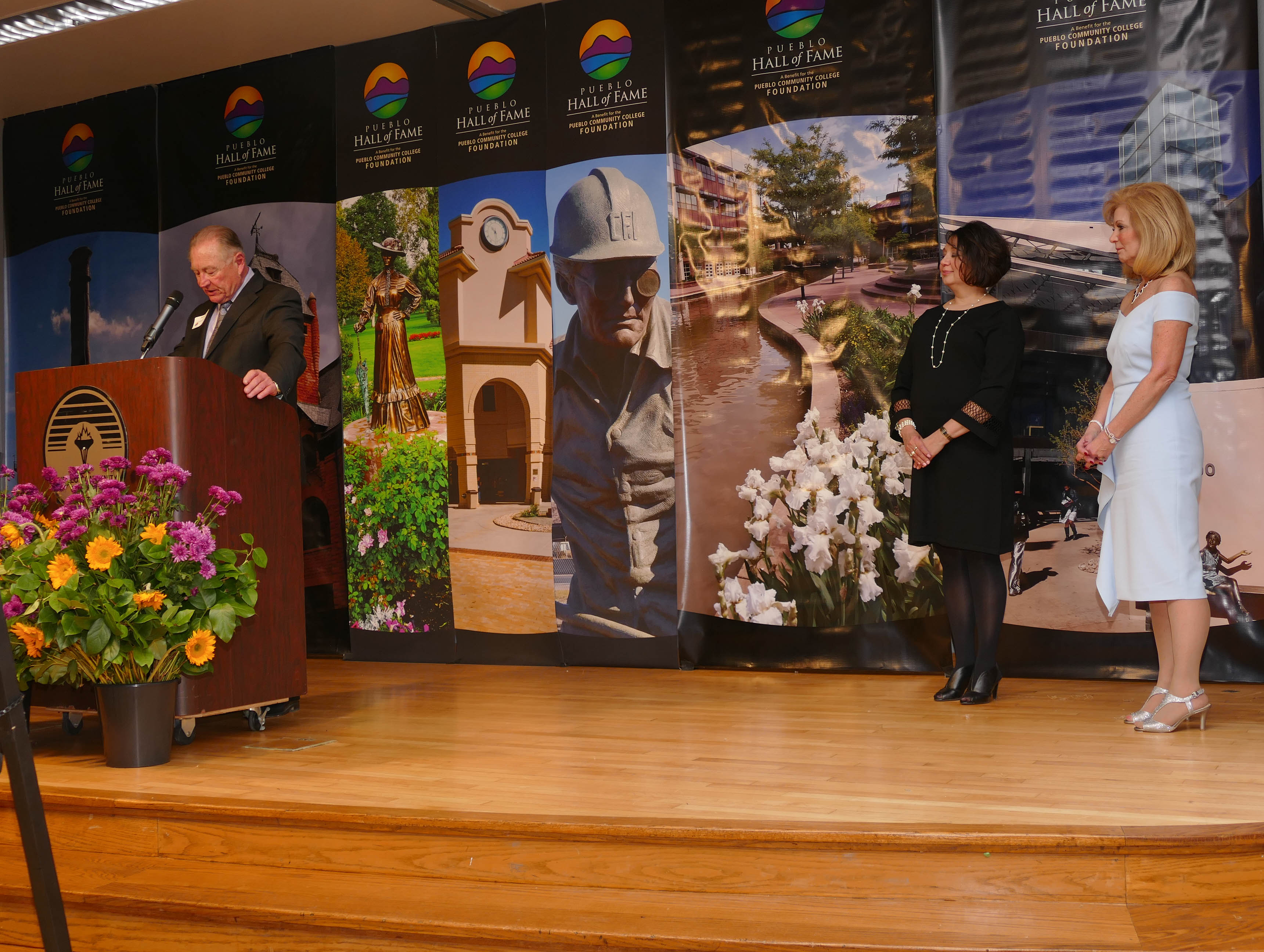Mayor Nick Gradisar on stage with Theresa Dudley and Dr. Patty Erjavec