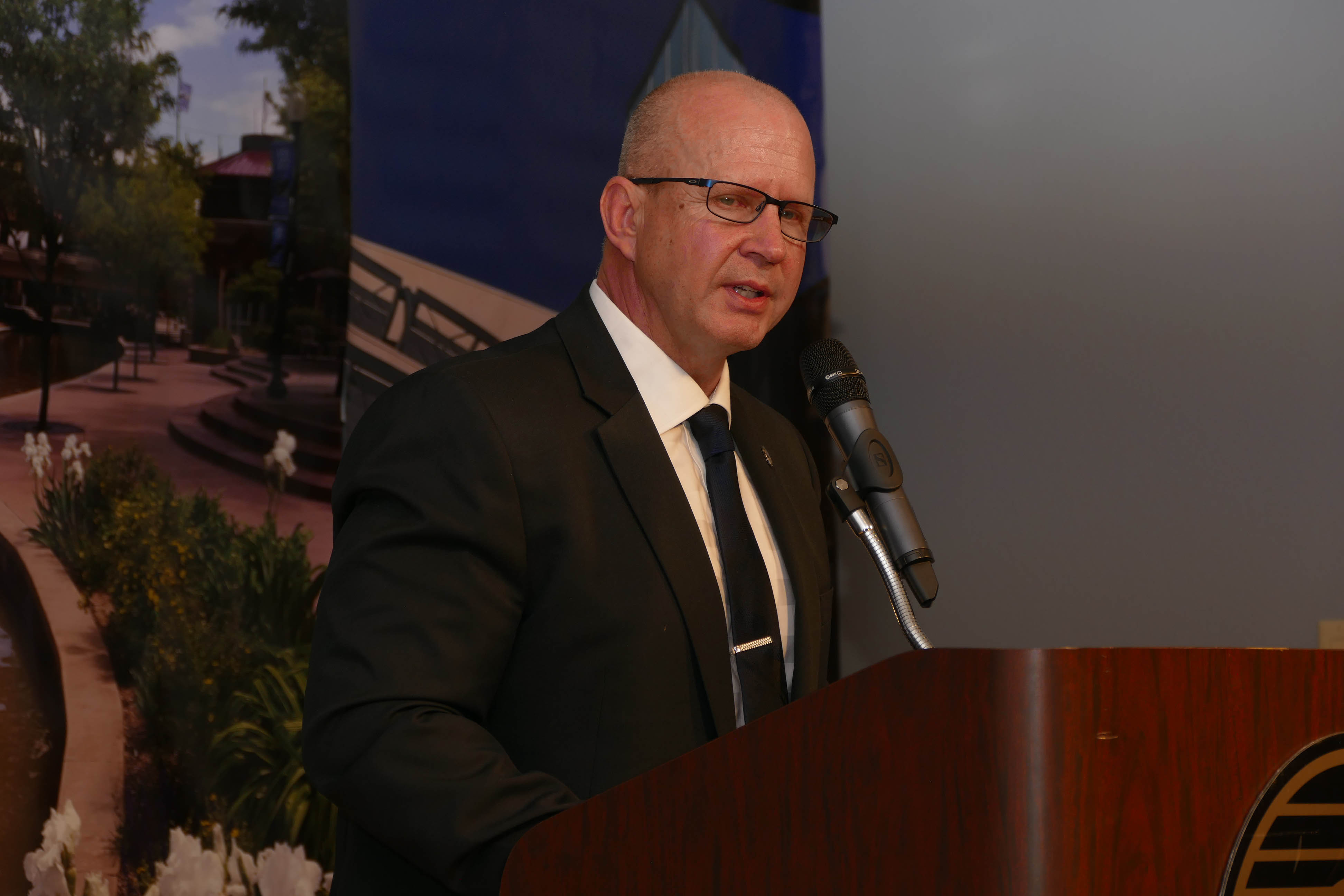 Andrew Trainor says a few words during his induction