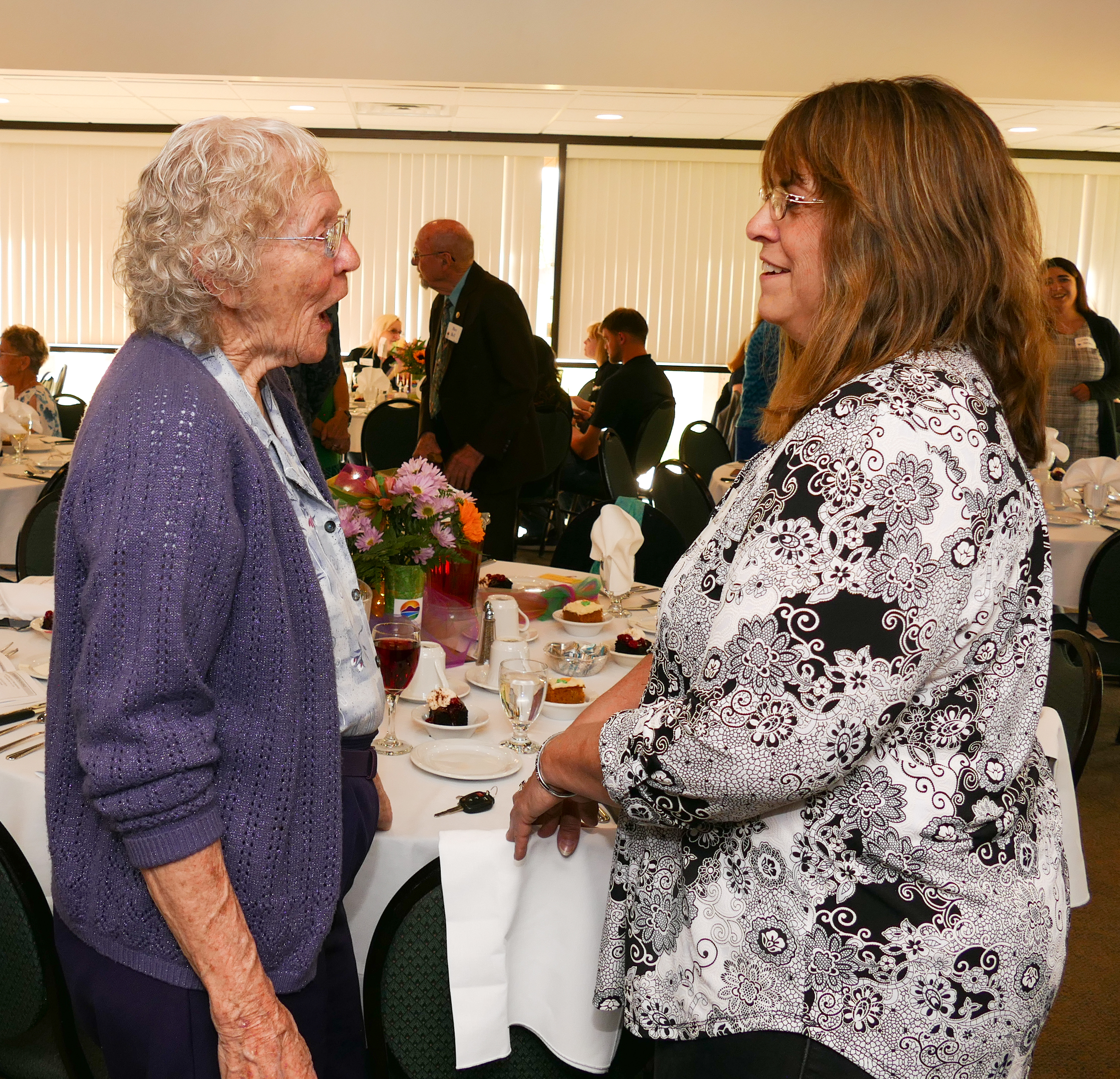 Mabel Stoker, left, chats with Kathy McDowell